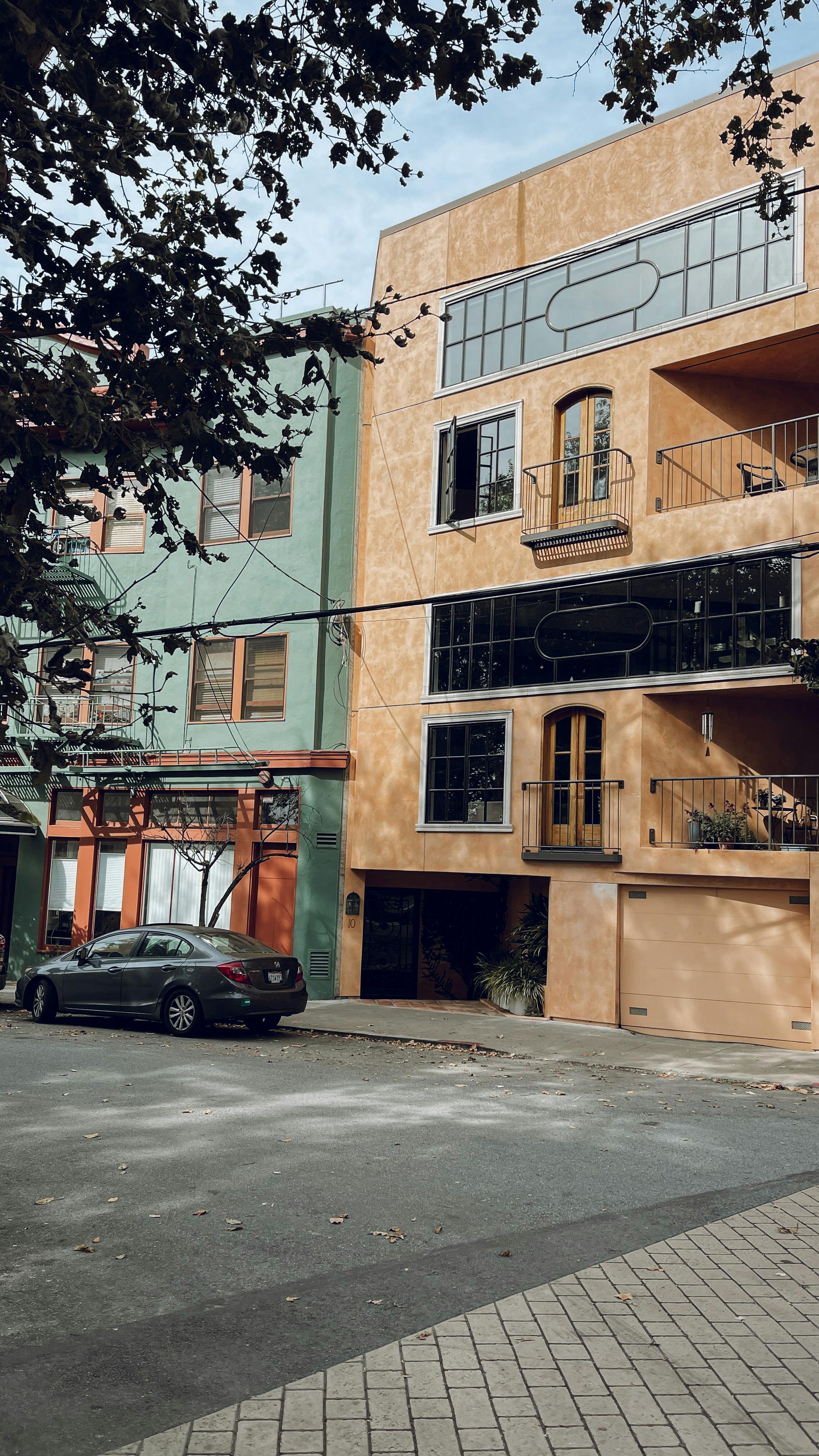 White and Beige Concrete High-rise Building · Free Stock Photo