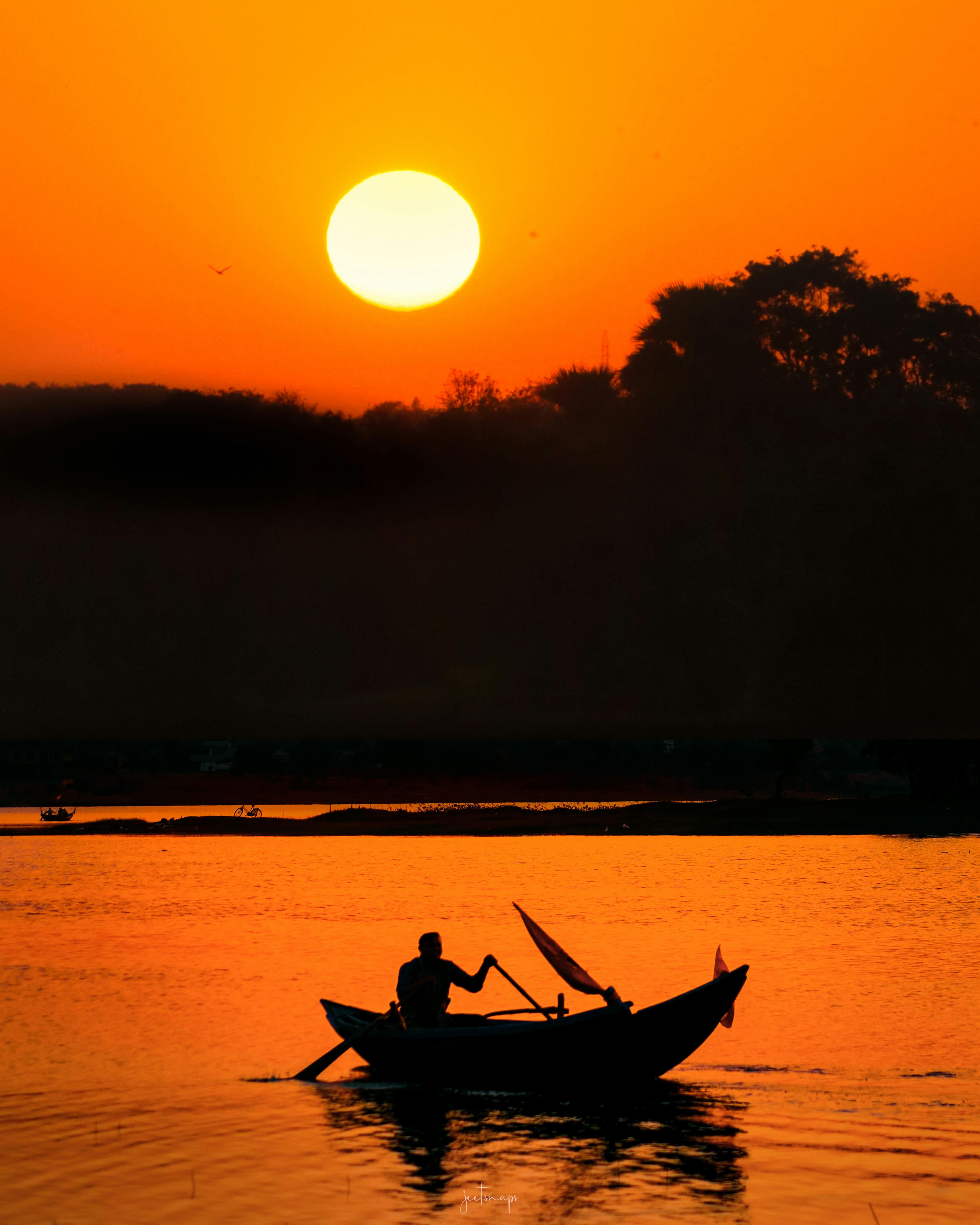 Man in Rowboat at Golden Sunset · Free Stock Photo