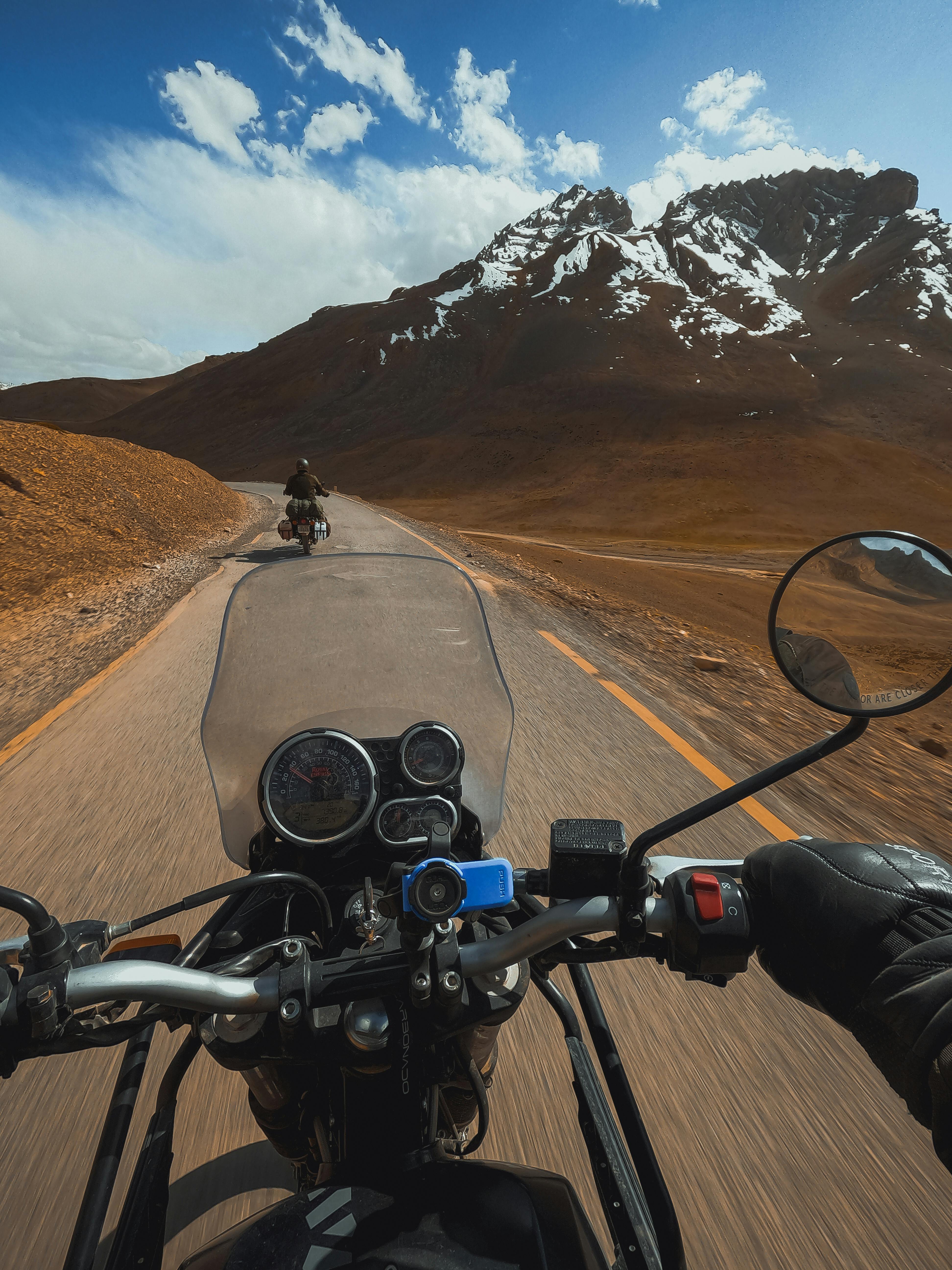 Man Riding Motorbike in Mountains · Free Stock Photo