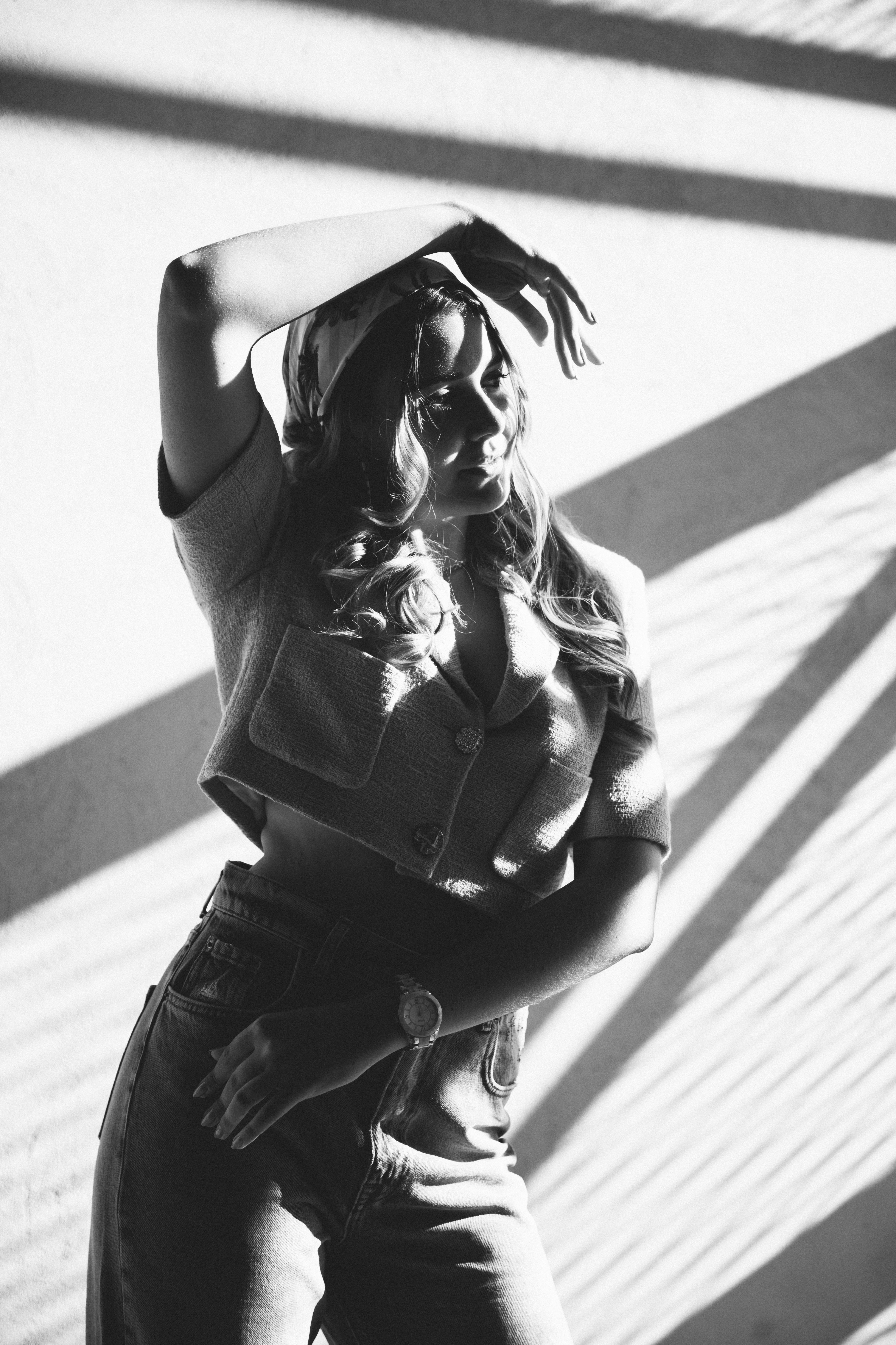 Young Woman Posing in Shadows · Free Stock Photo