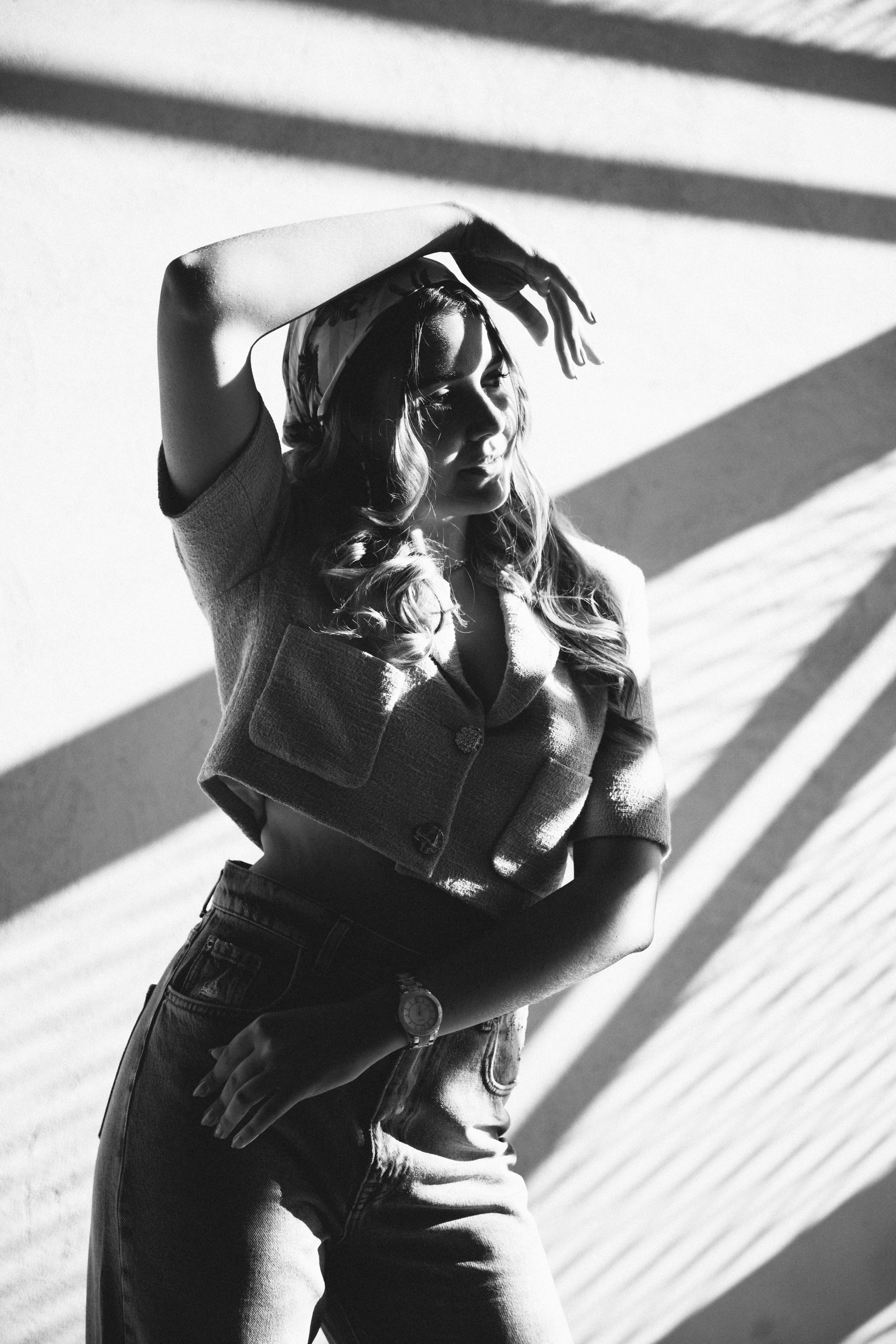 Young Woman Posing in Shadows · Free Stock Photo