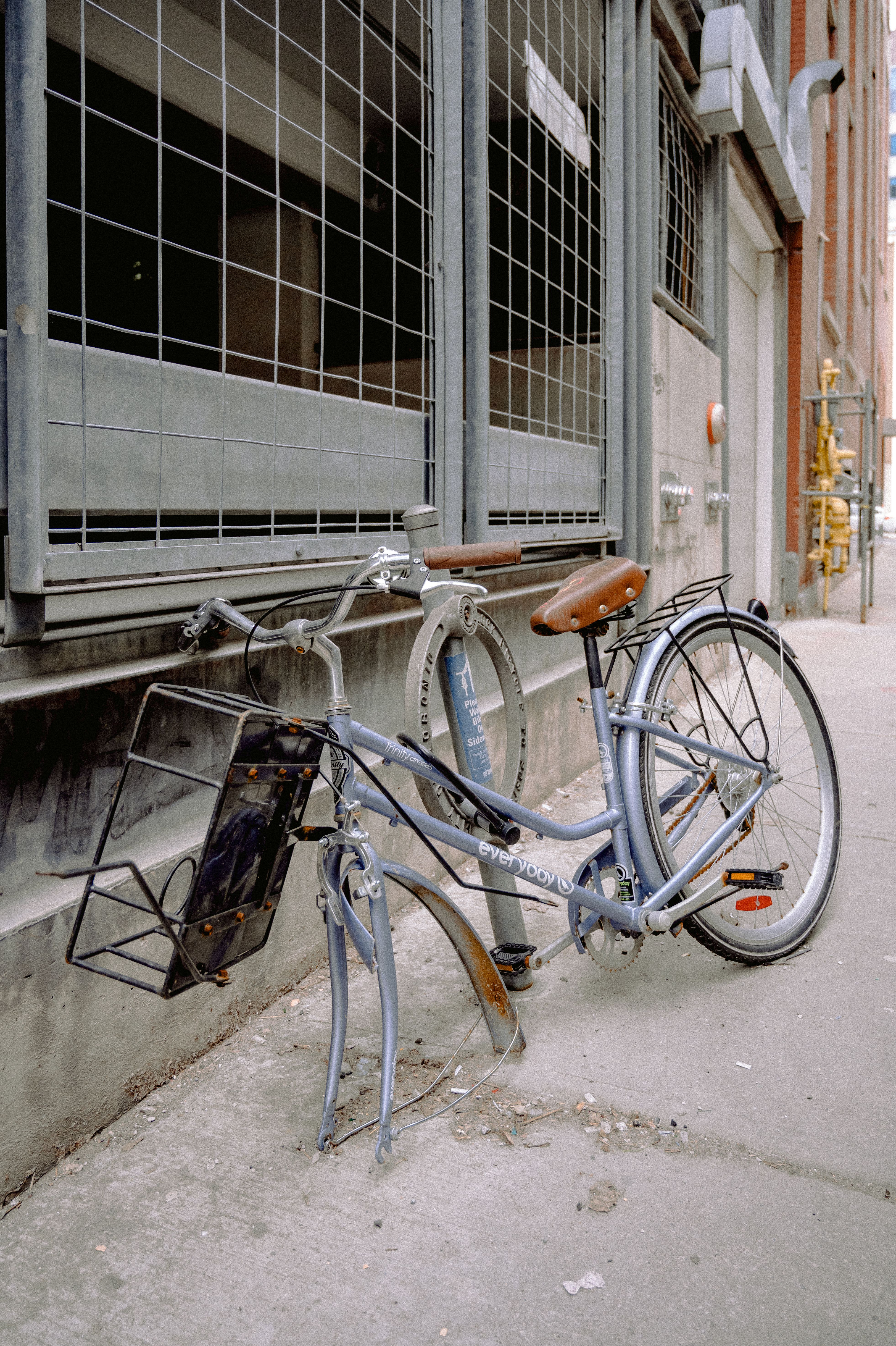 Broken Bicycle on the Sidewalk · Free Stock Photo