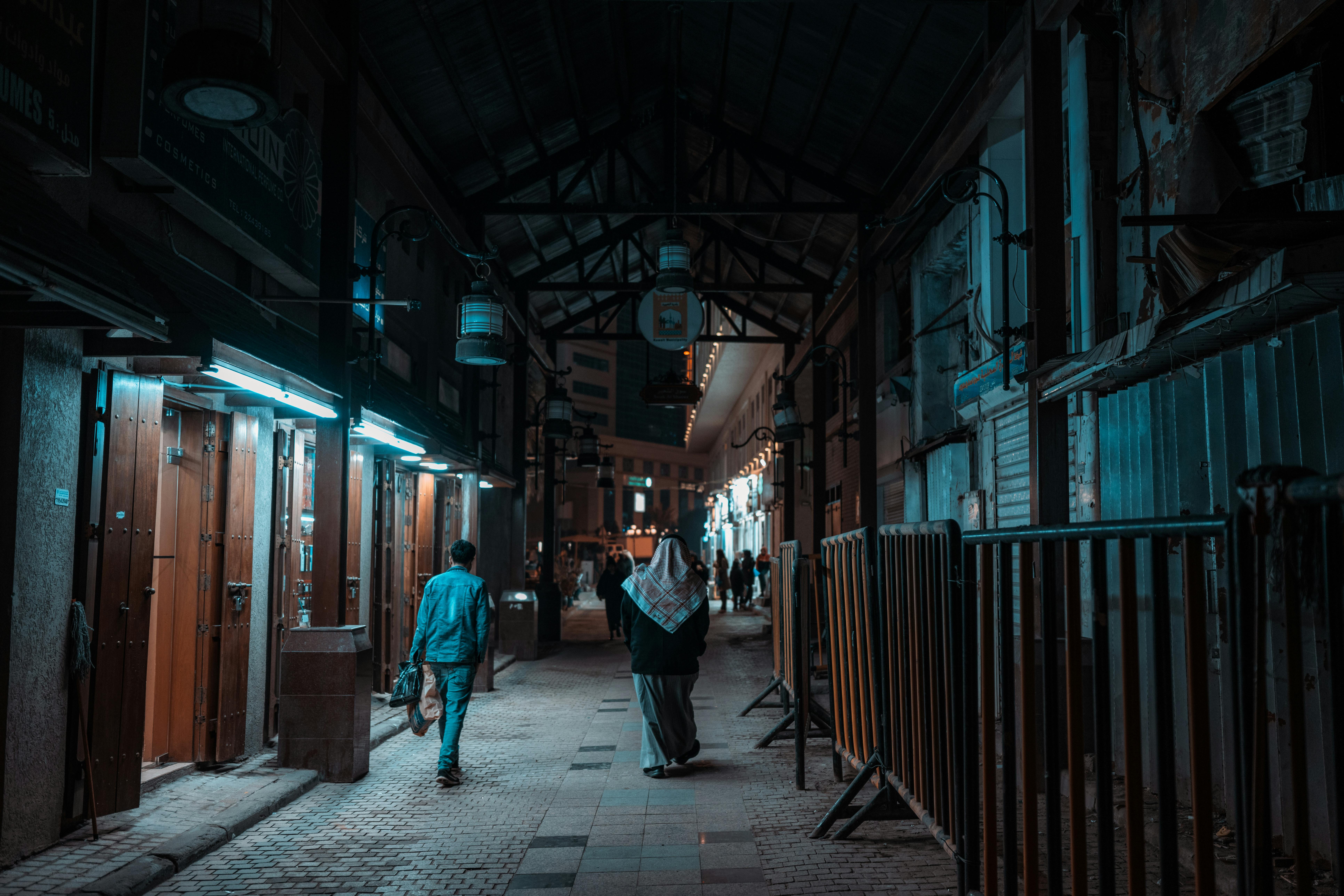 People Walking in a Dark Alley in City · Free Stock Photo