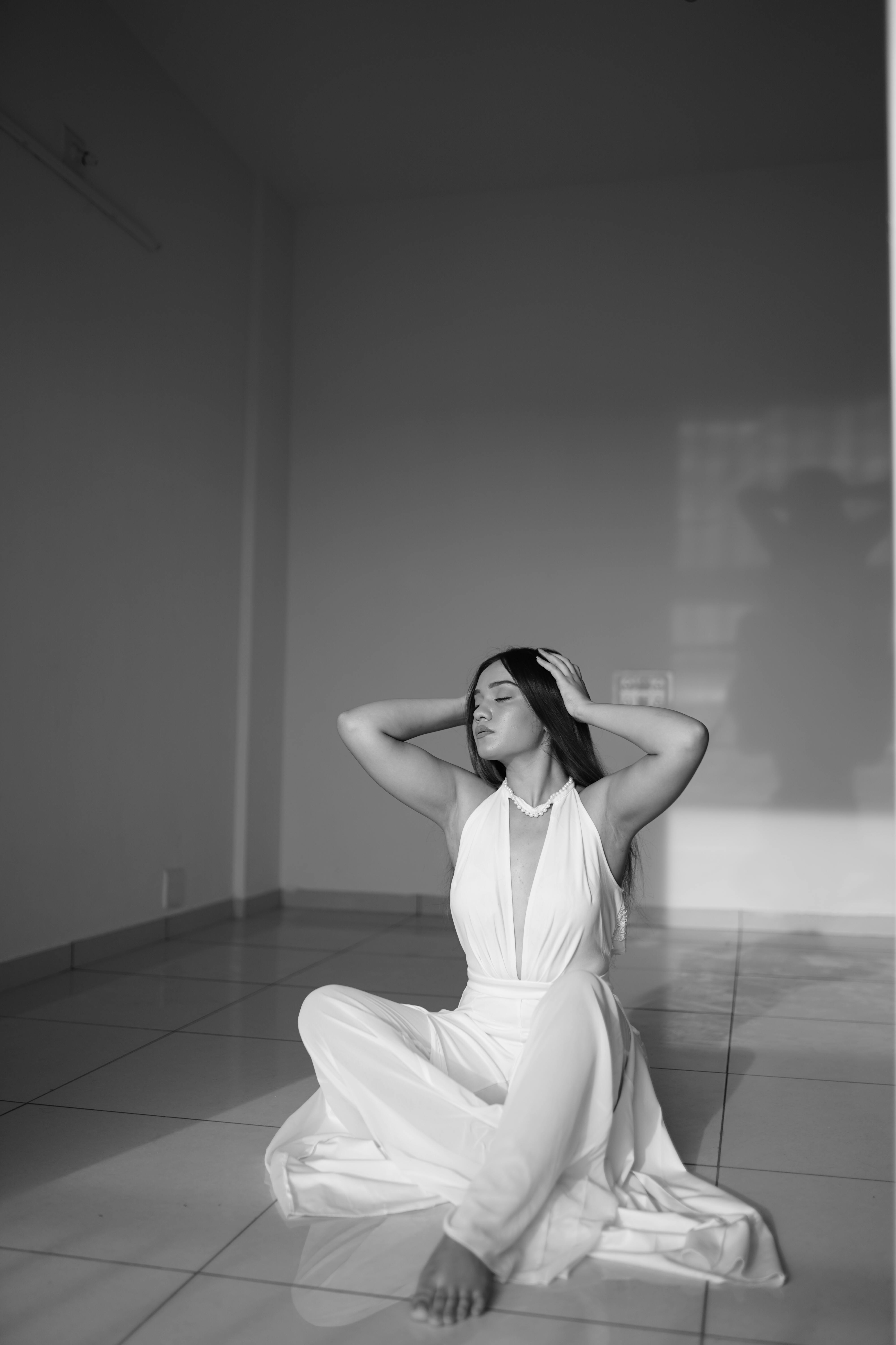 Woman Posing in Modest Black Dress · Free Stock Photo