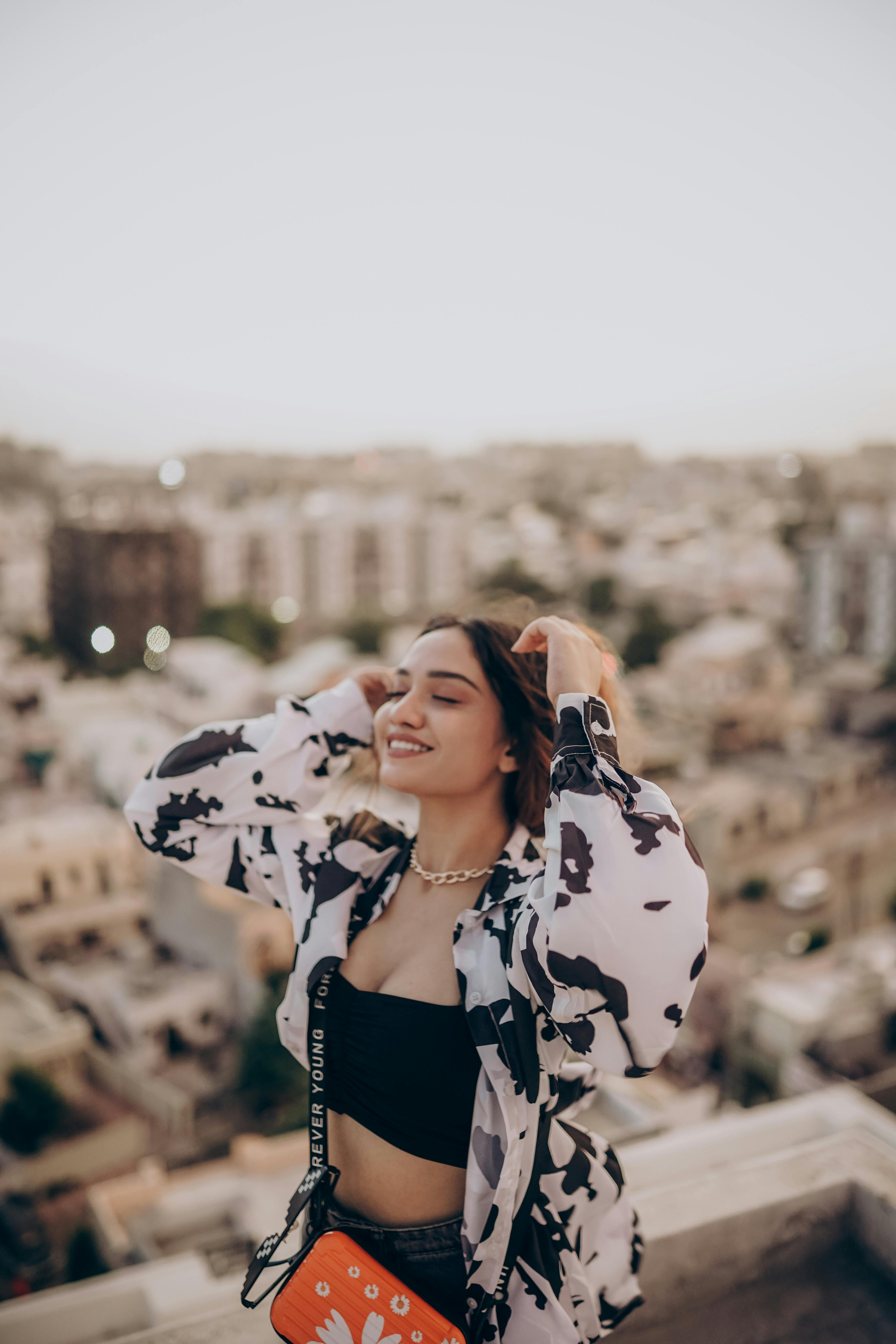 Woman in Elegant Crop Top Smoking Cigarette · Free Stock Photo