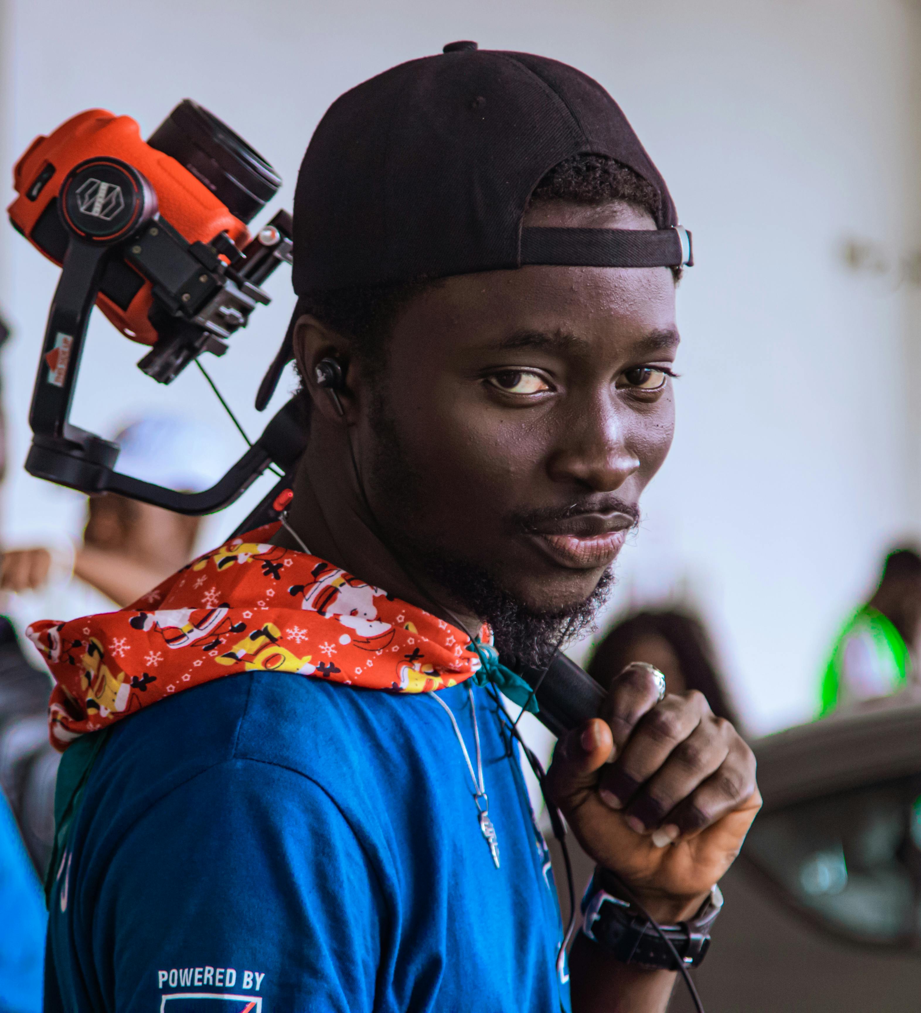 Man in Cap and with Camera on Tripod · Free Stock Photo