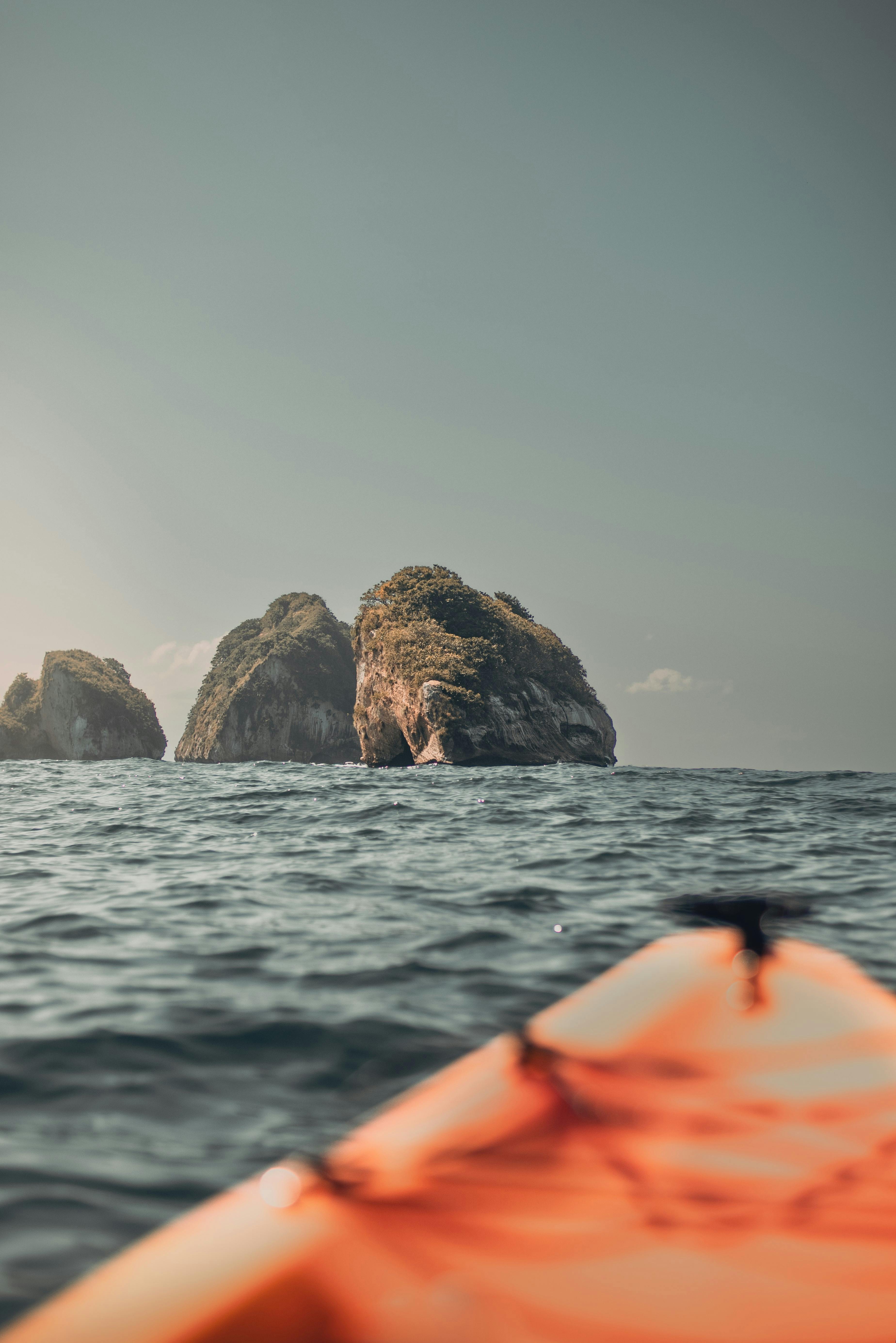 Rocks in Sea Seen from Rowboat · Free Stock Photo