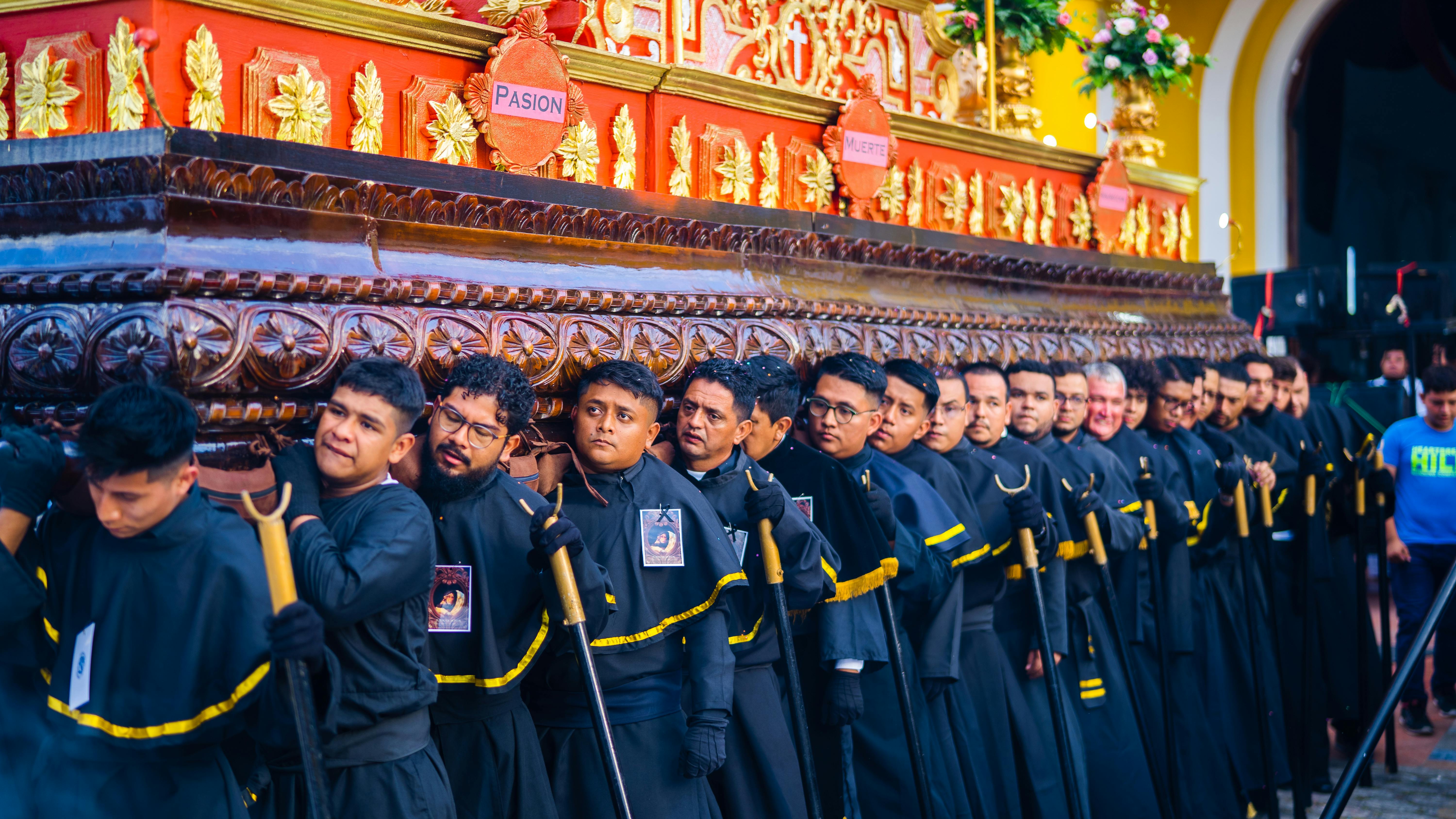 Men in Black Gowns in Traditional Parade · Free Stock Photo