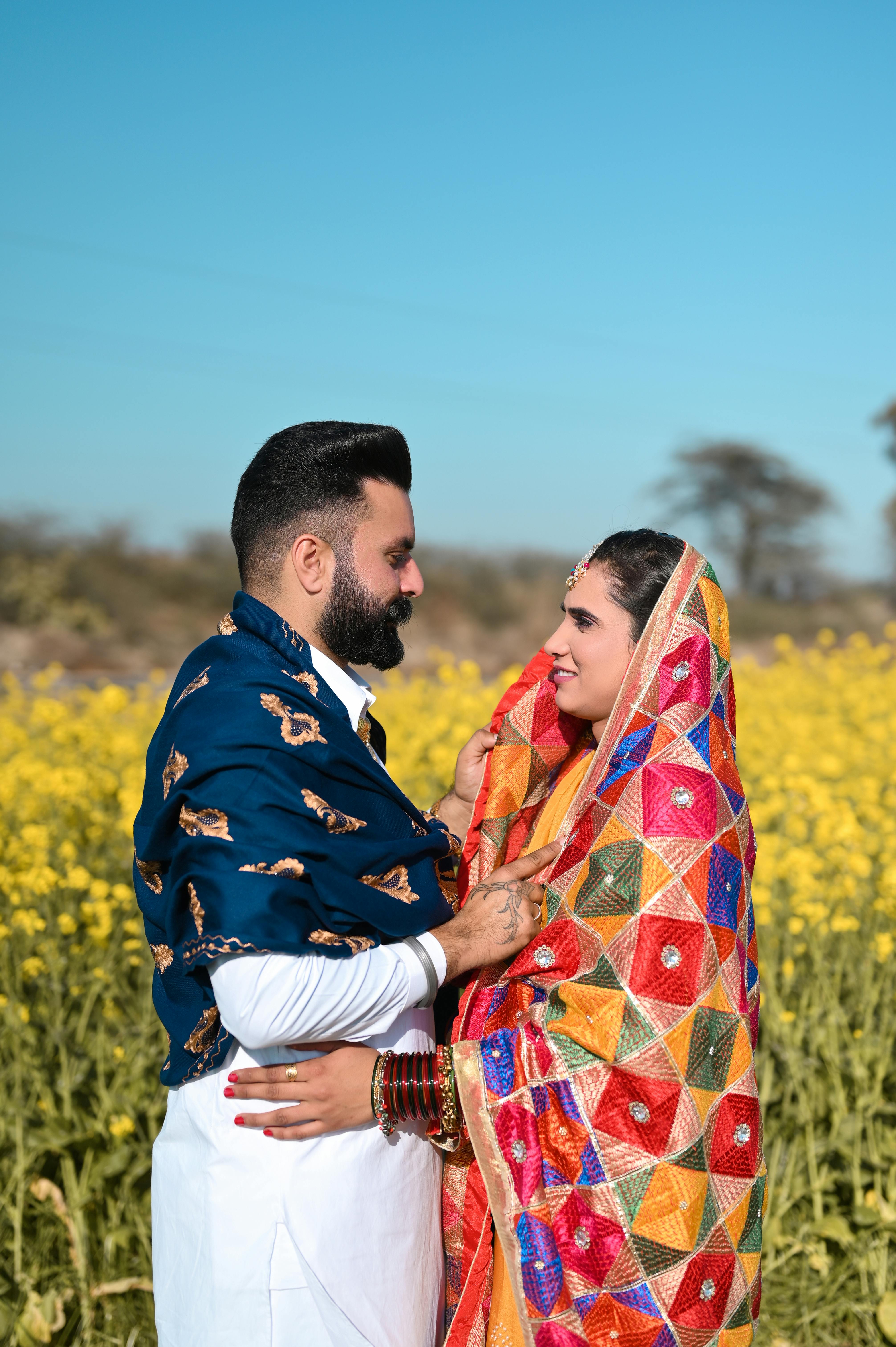Couple in Traditional Clothing · Free Stock Photo