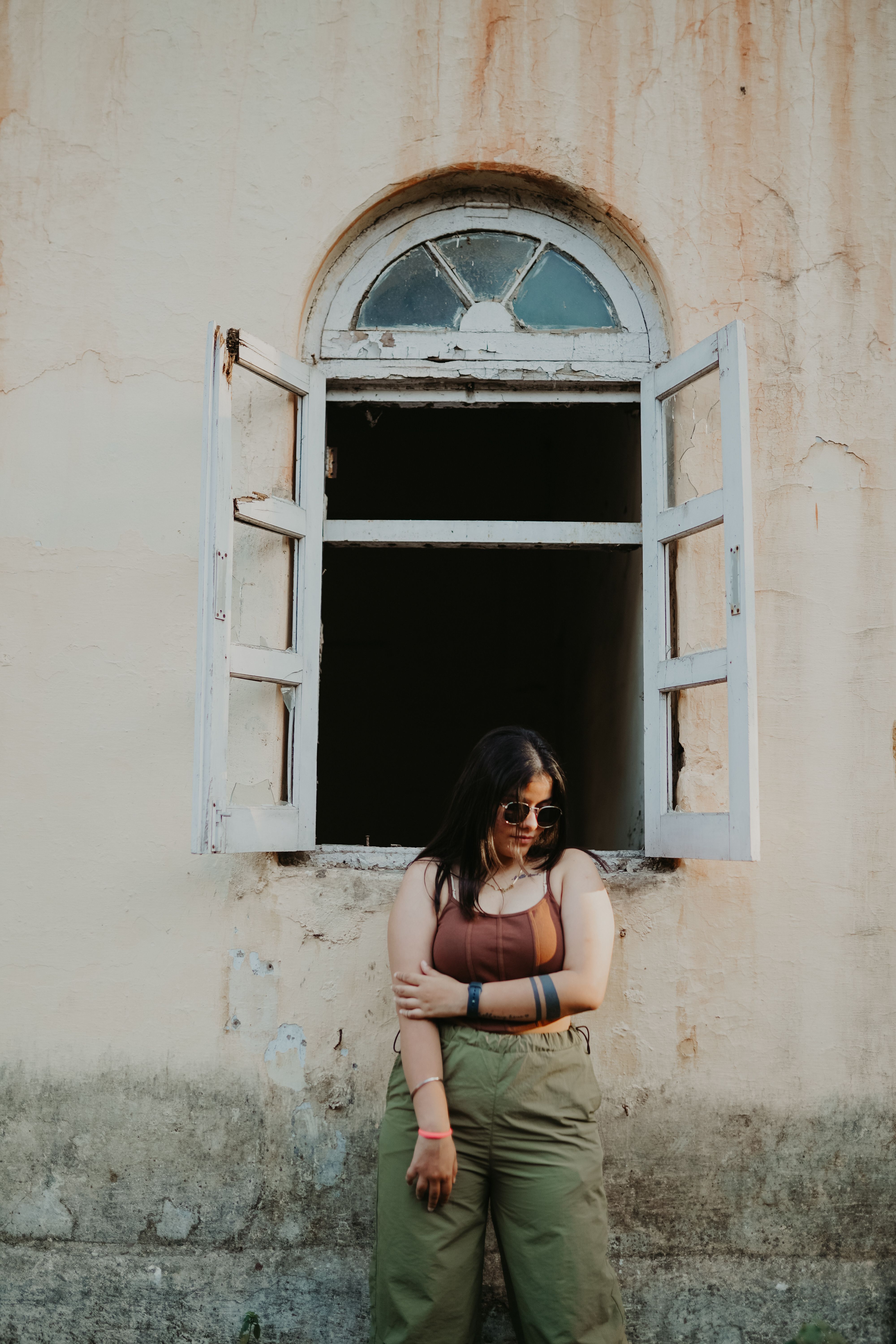 A Young Woman Posing in front of the Window · Free Stock Photo
