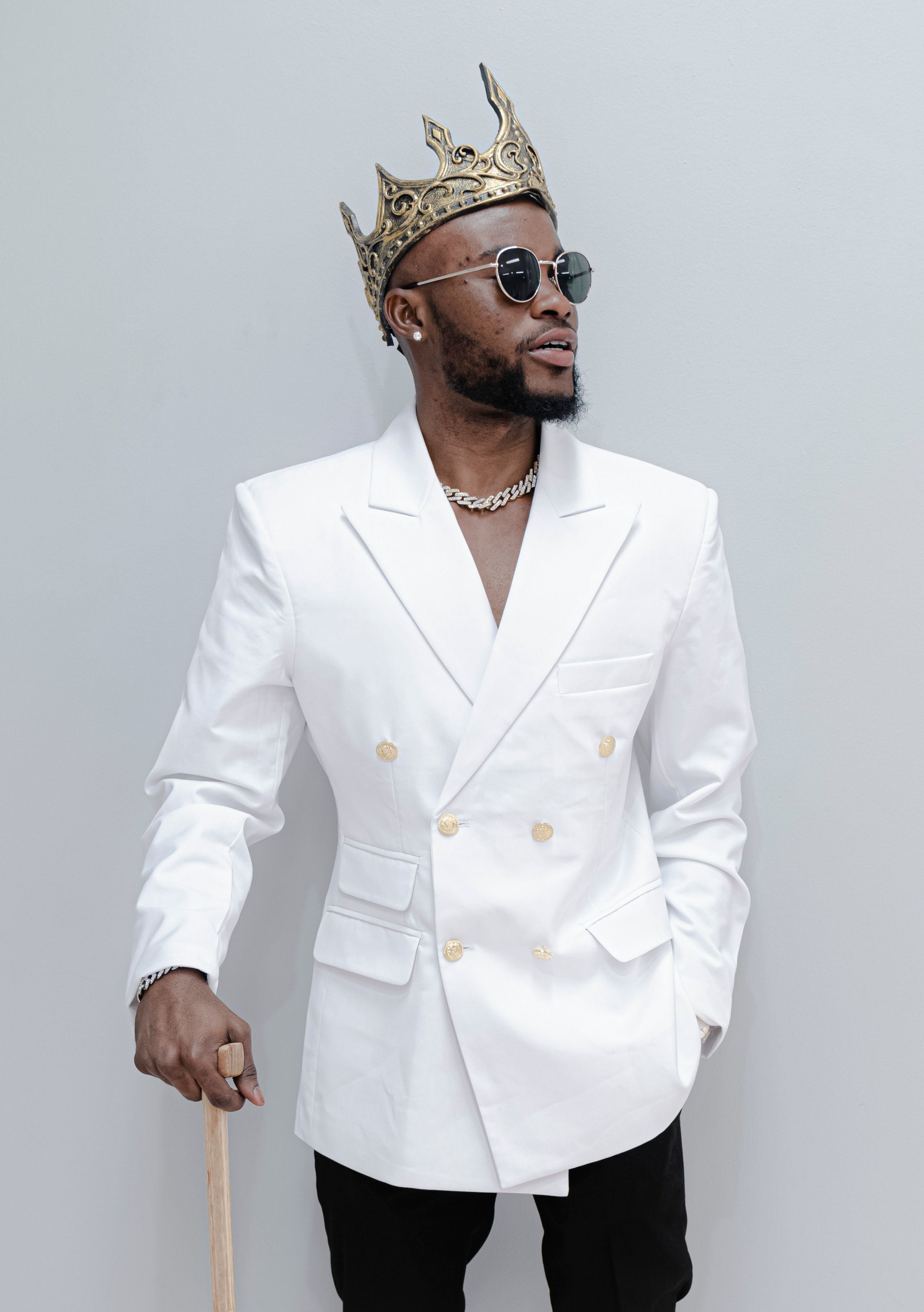 Portrait of a Male Model Wearing a Crown and a White Jacket · Free ...