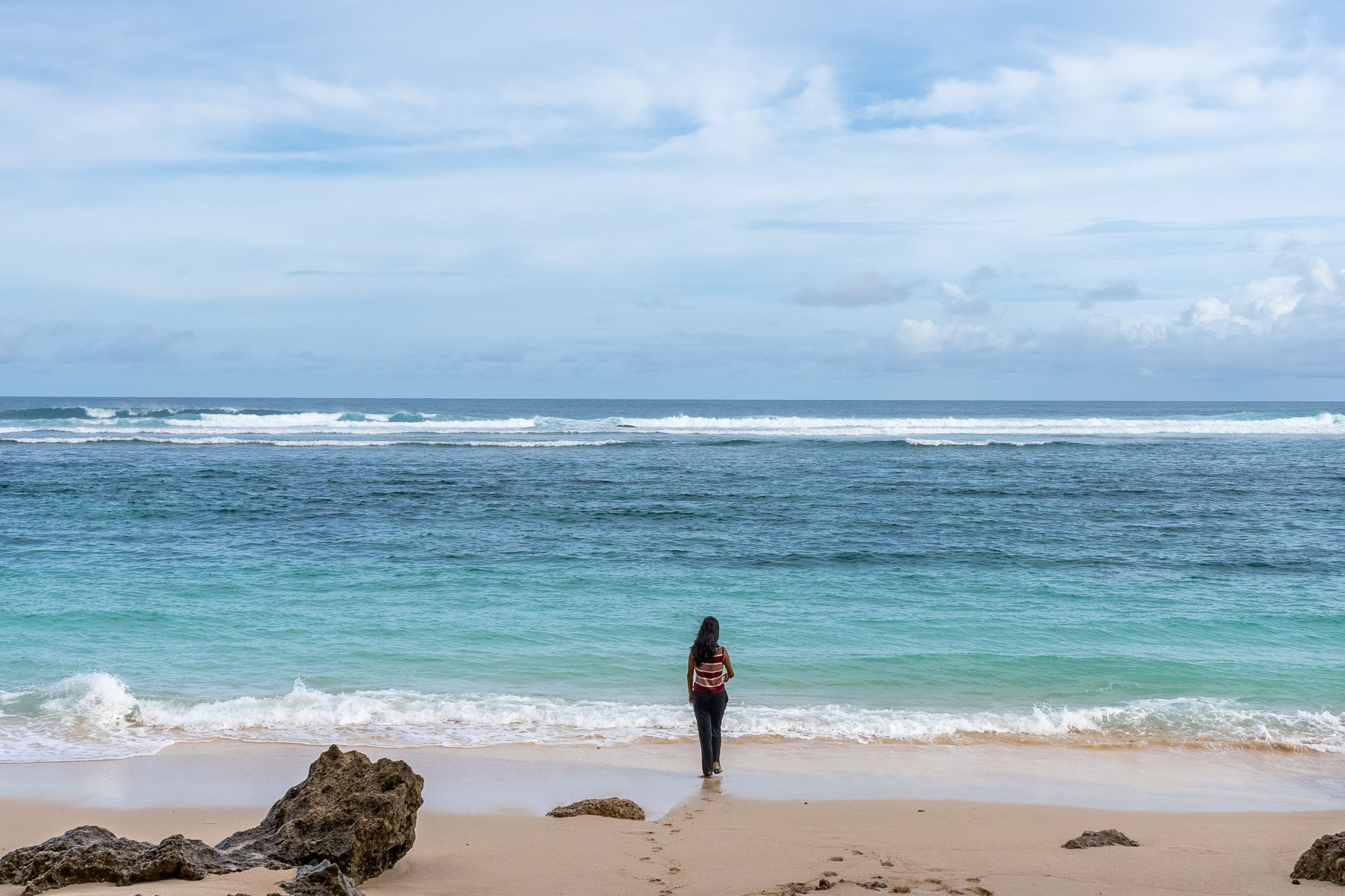 A Woman Writing Numbers on Sand with Her Hand · Free Stock Photo