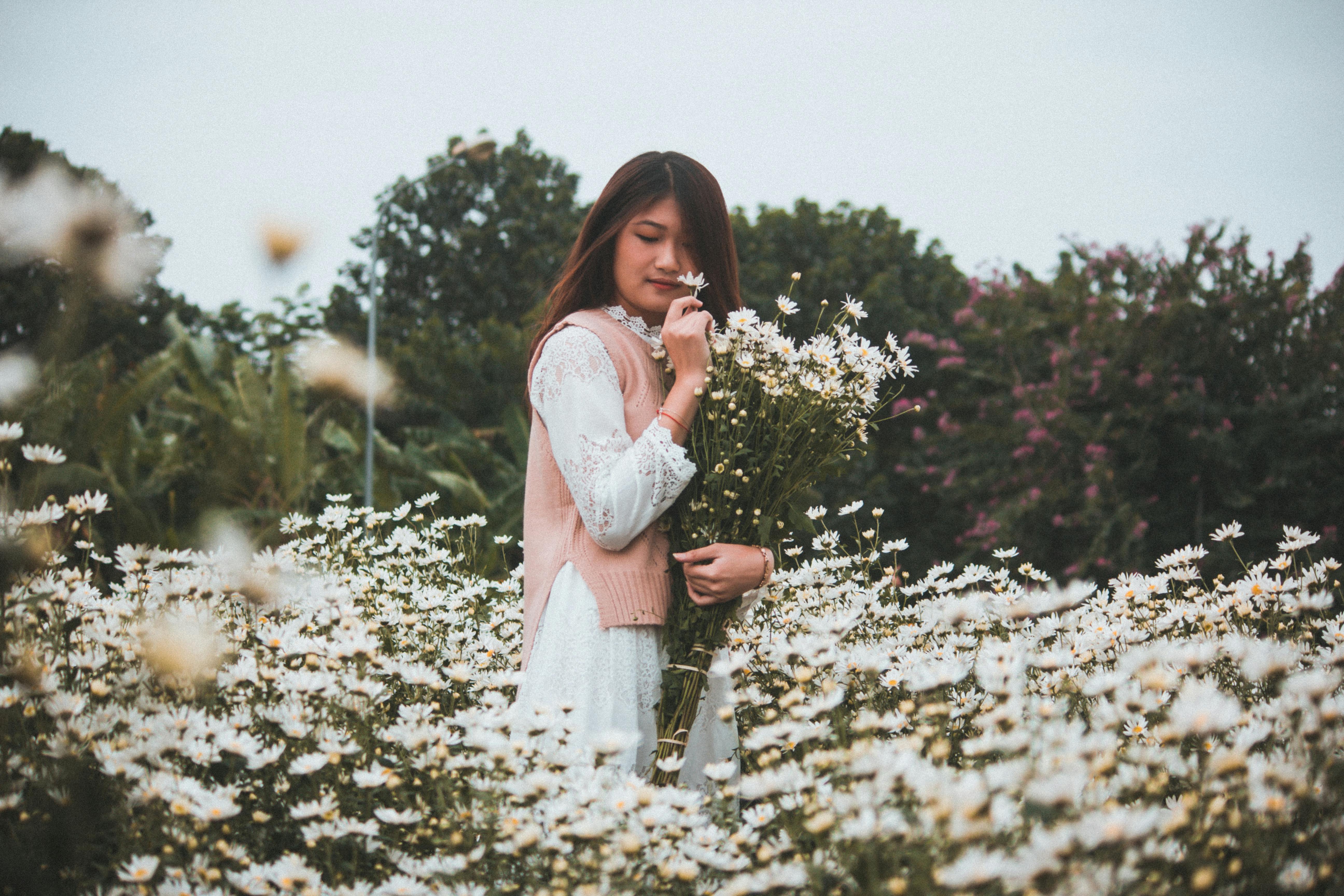 Woman Surrounded By White Petaled Flowers · Free Stock Photo