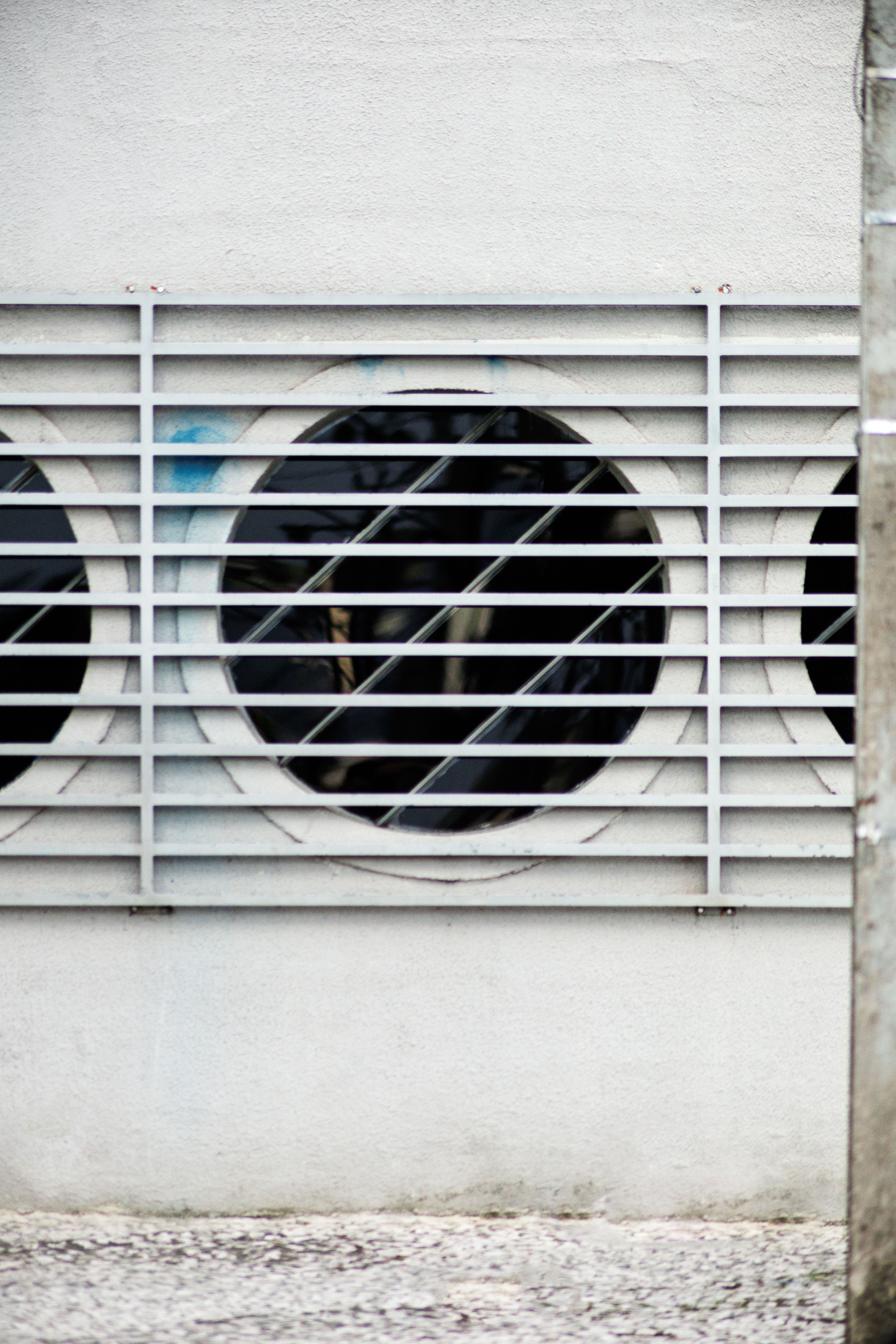 Bars on Air Conditioner Window · Free Stock Photo