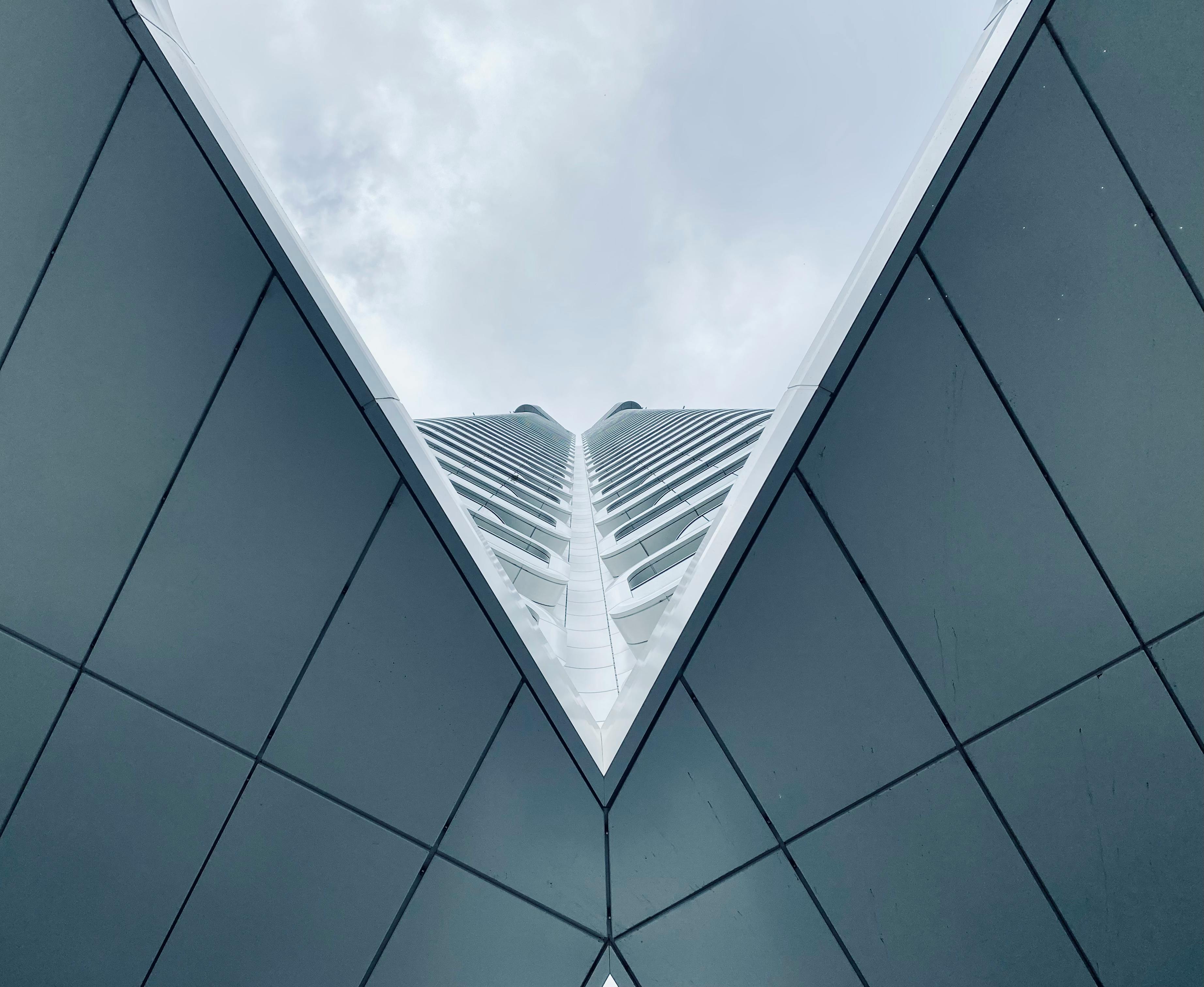 Woman Standing Next to Building · Free Stock Photo