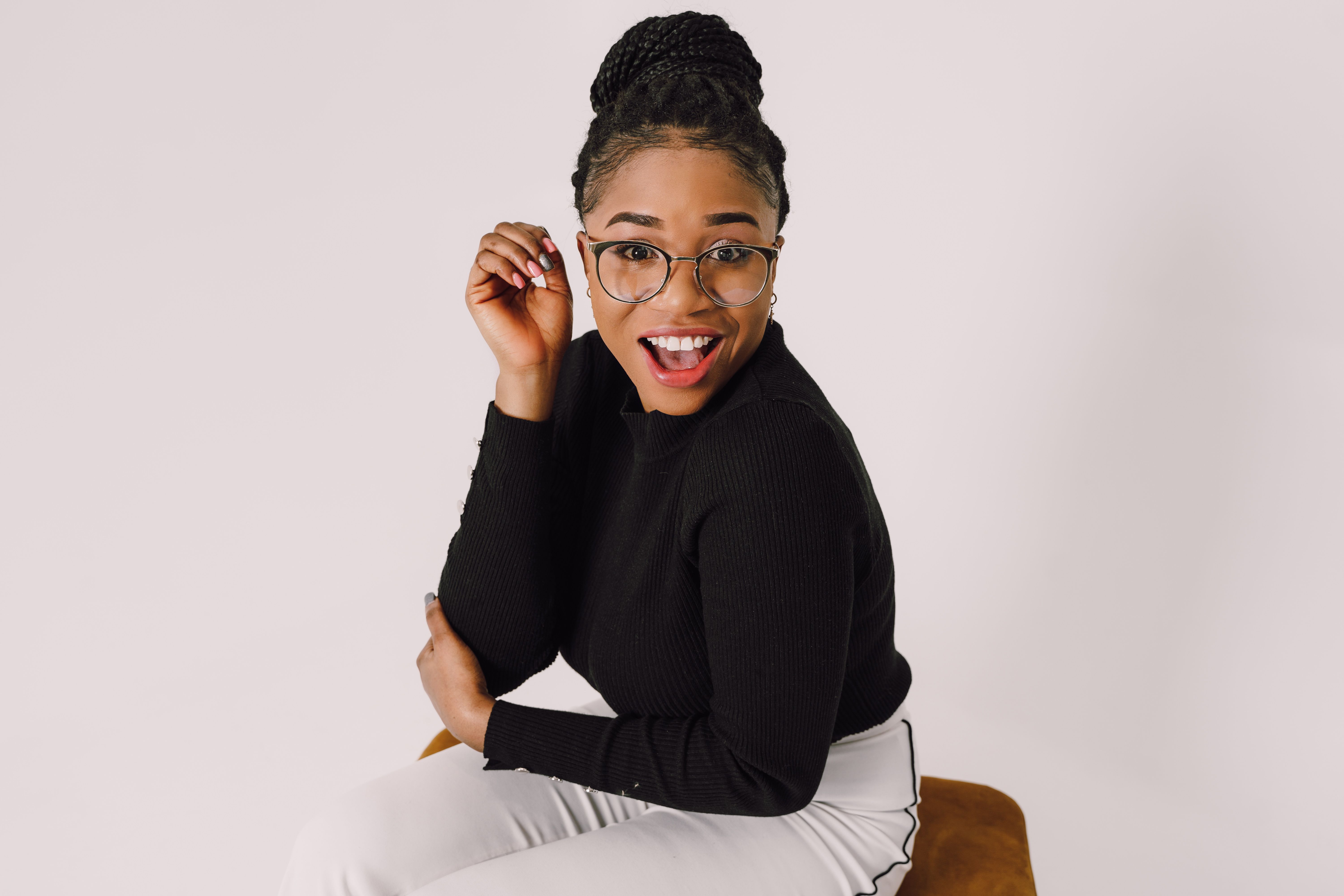 Woman Sitting and Smiling · Free Stock Photo