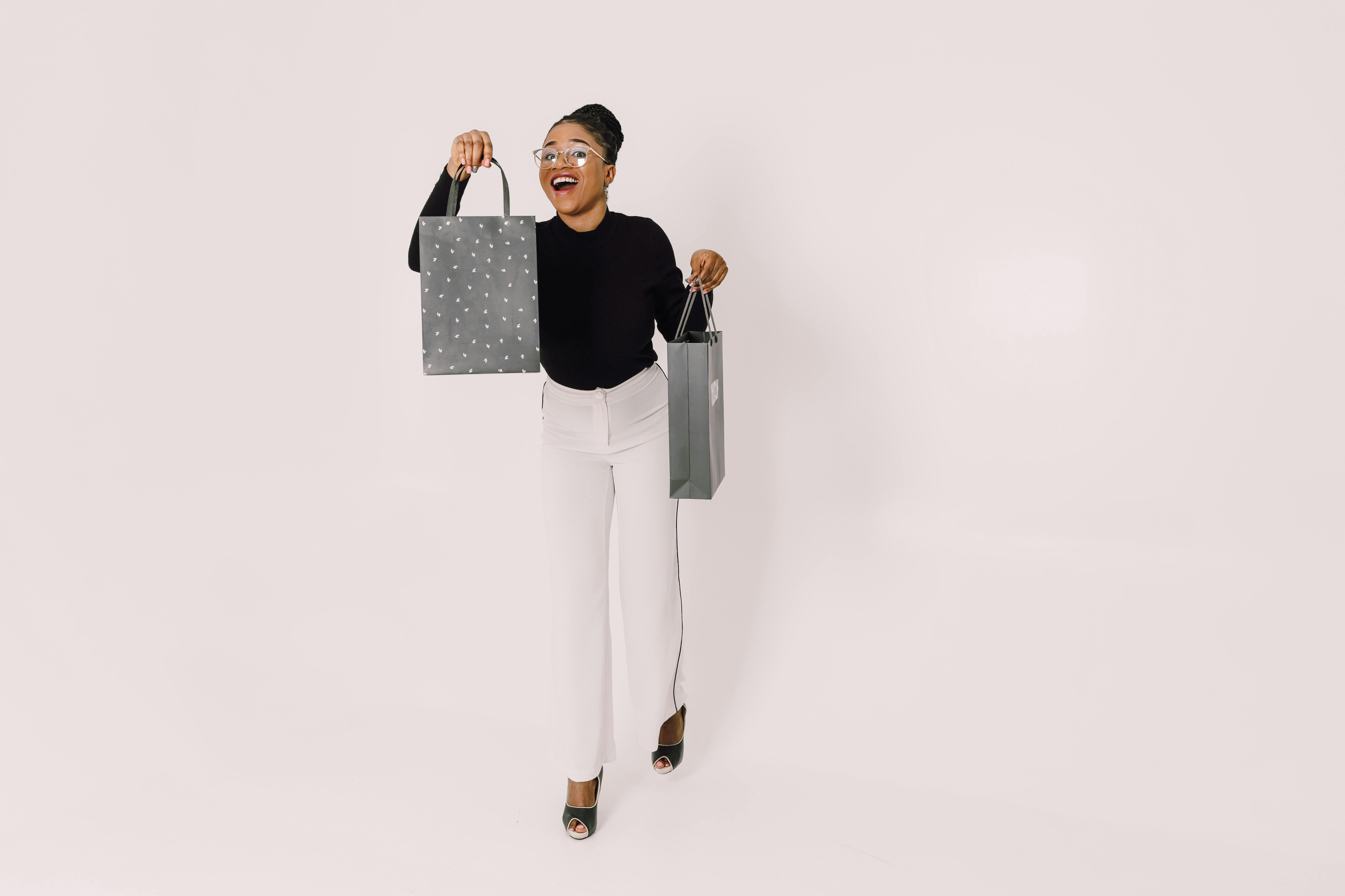 Woman Posing with Shopping Bags · Free Stock Photo