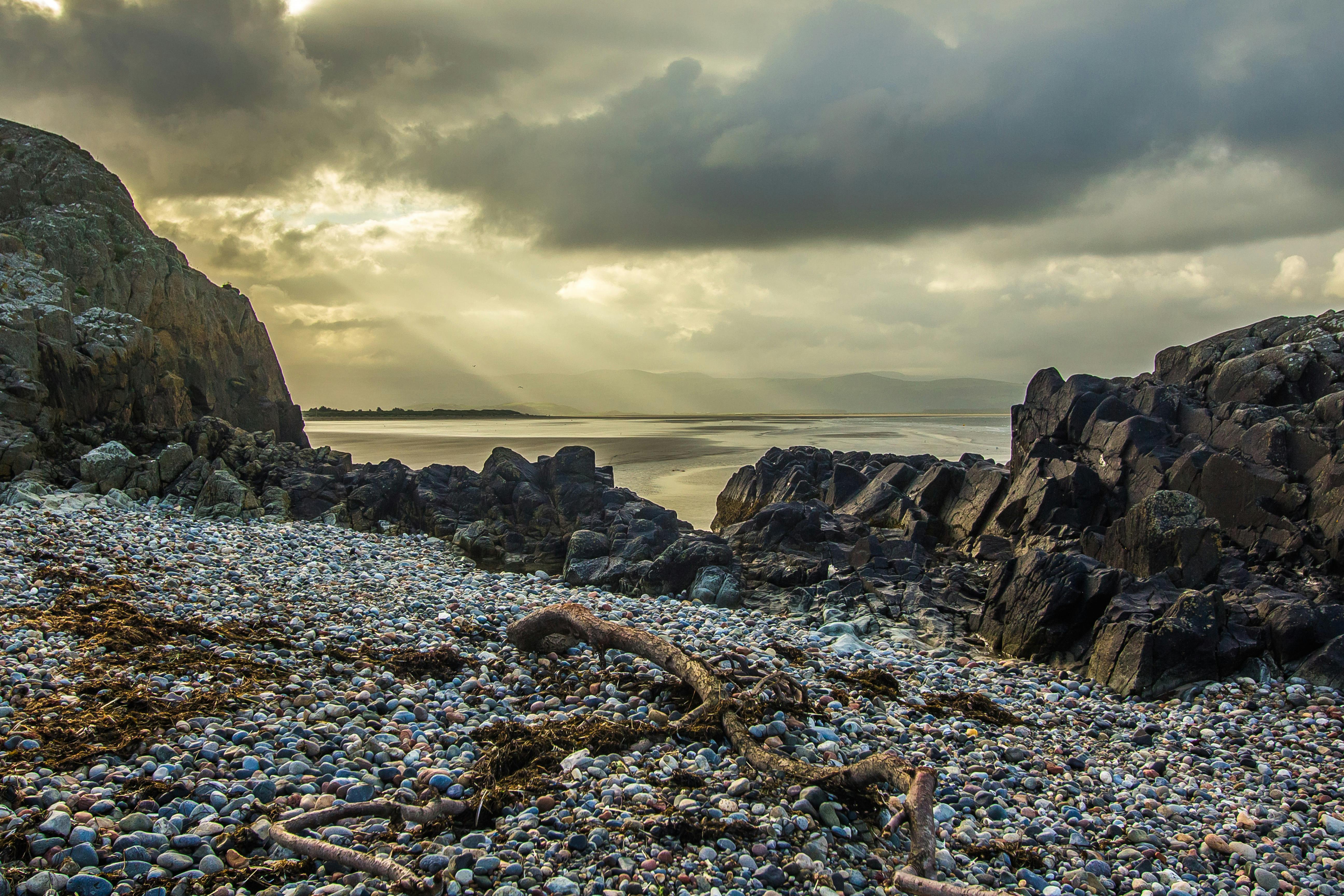 Black Rock Formation on the Sea during Sunset · Free Stock Photo