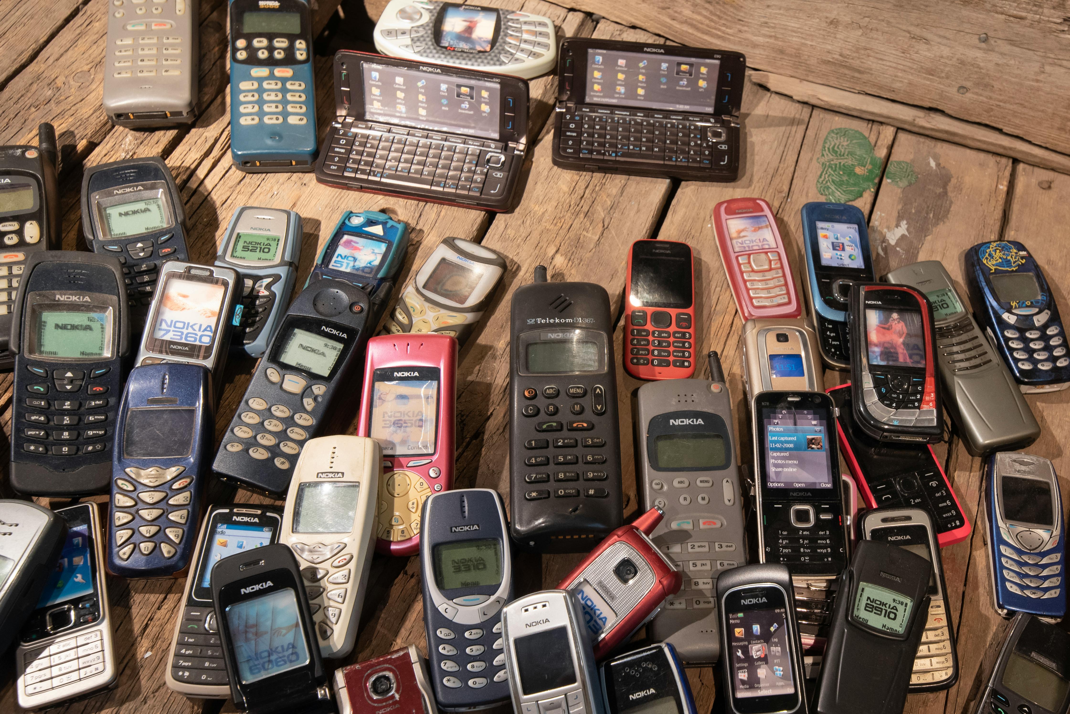Stack of Obsolete Phones · Free Stock Photo
