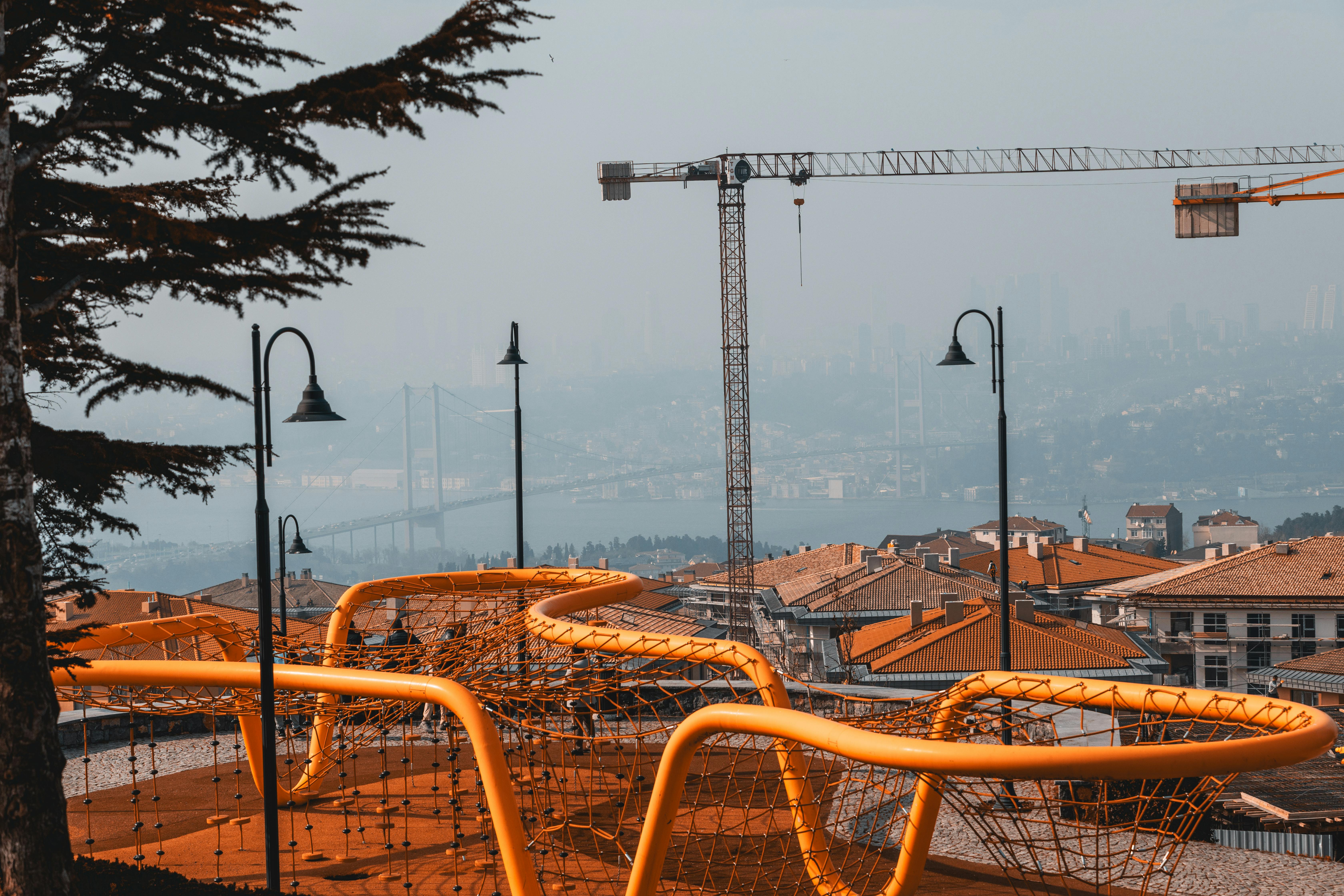 Playground and Construction Cranes behind in Istanbul · Free Stock Photo