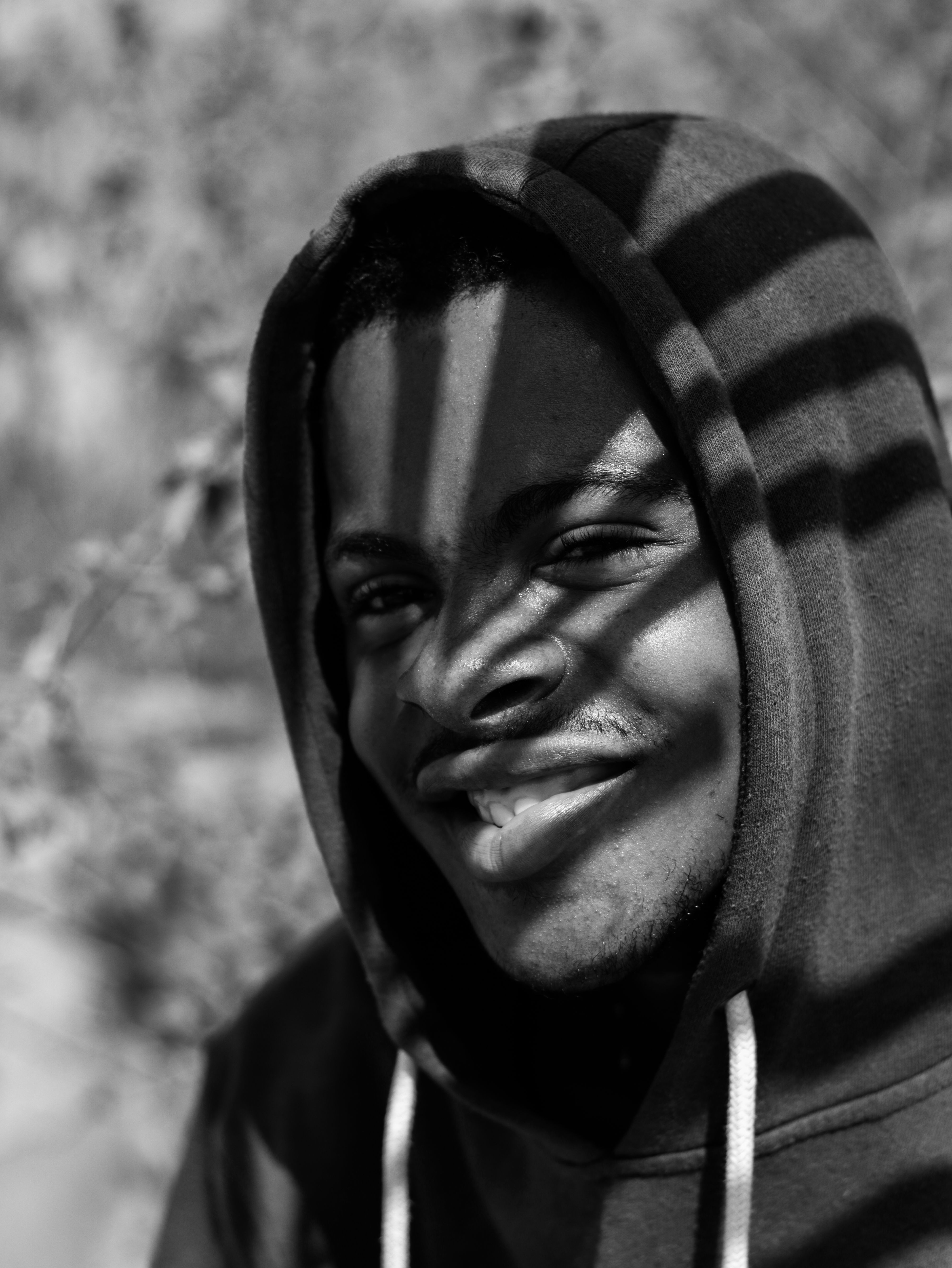 Smiling Man with Hood on Head · Free Stock Photo