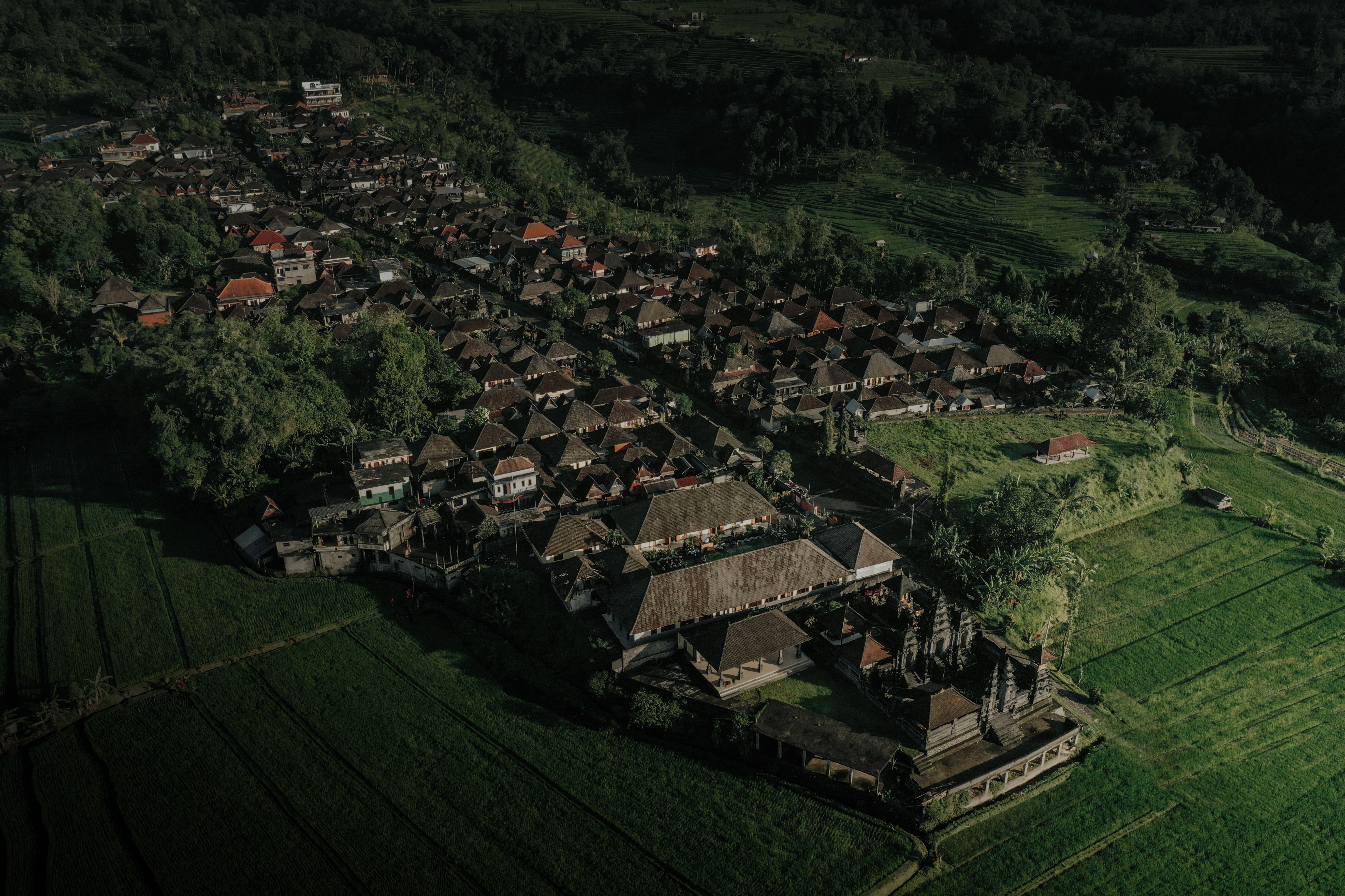 Aerial View of a Town Surrounded by Fields · Free Stock Photo