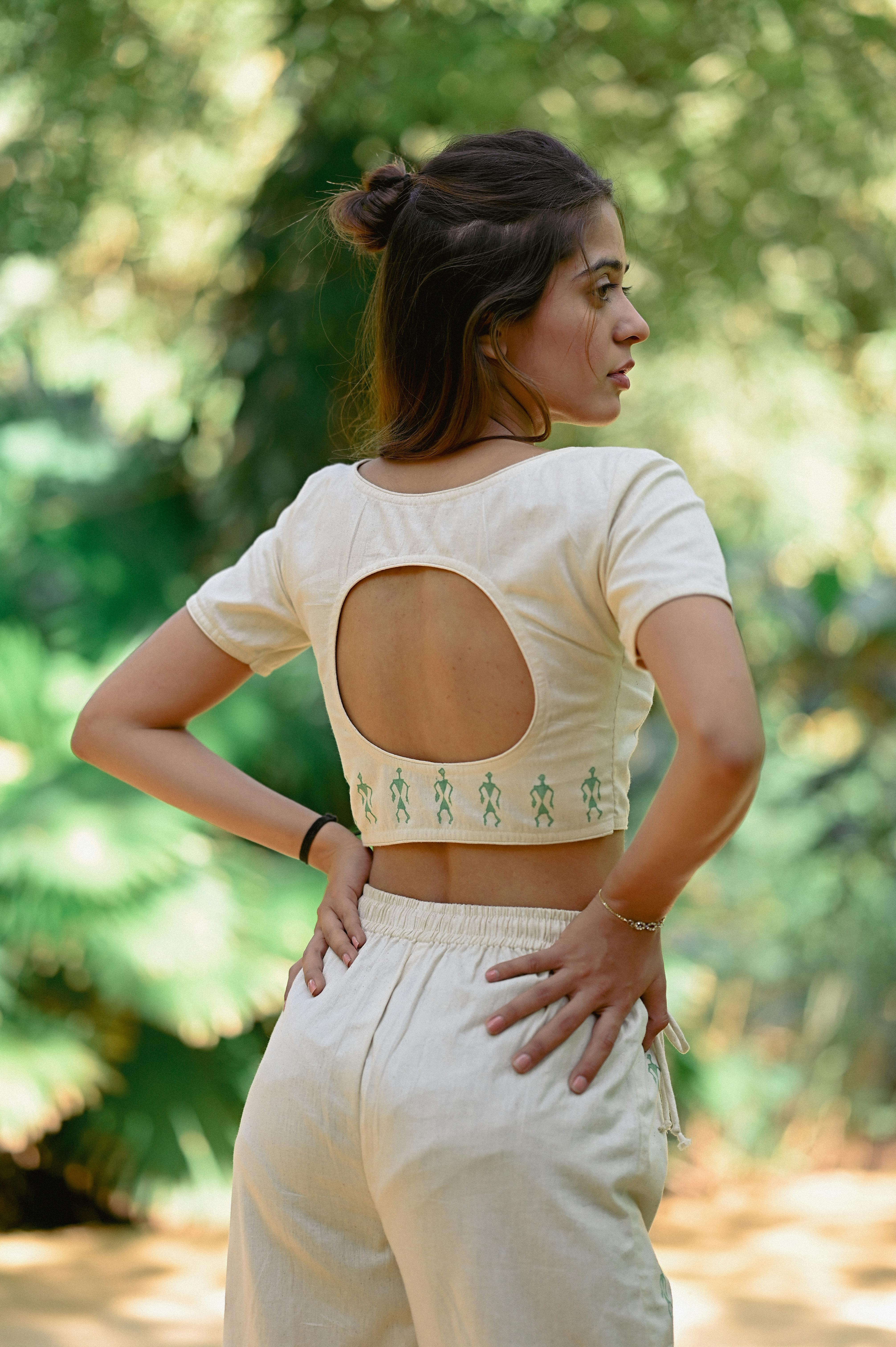 Young Woman in a Crop Top Standing Outdoors · Free Stock Photo