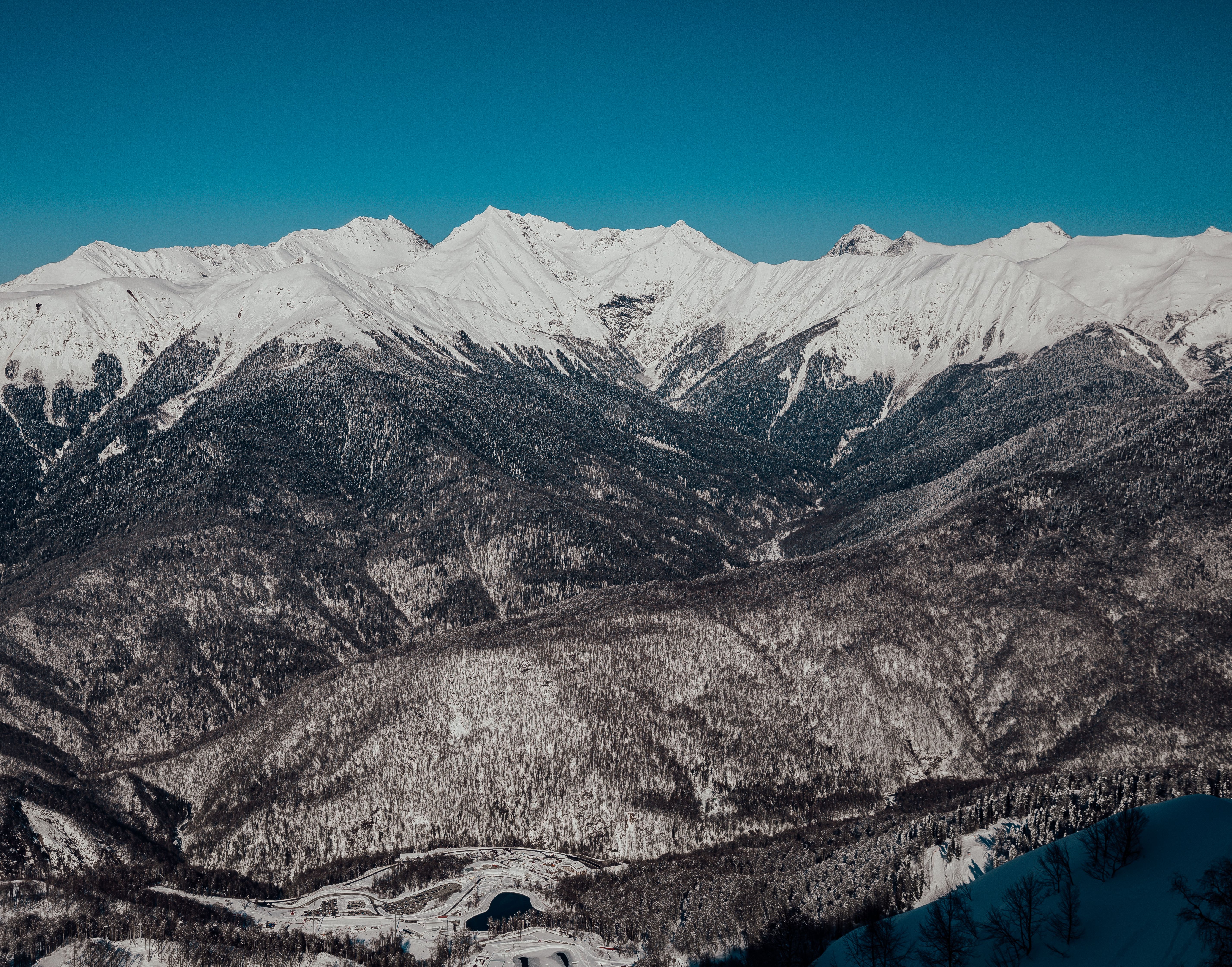 Aerial Photography Of Snowy Hill · Free Stock Photo