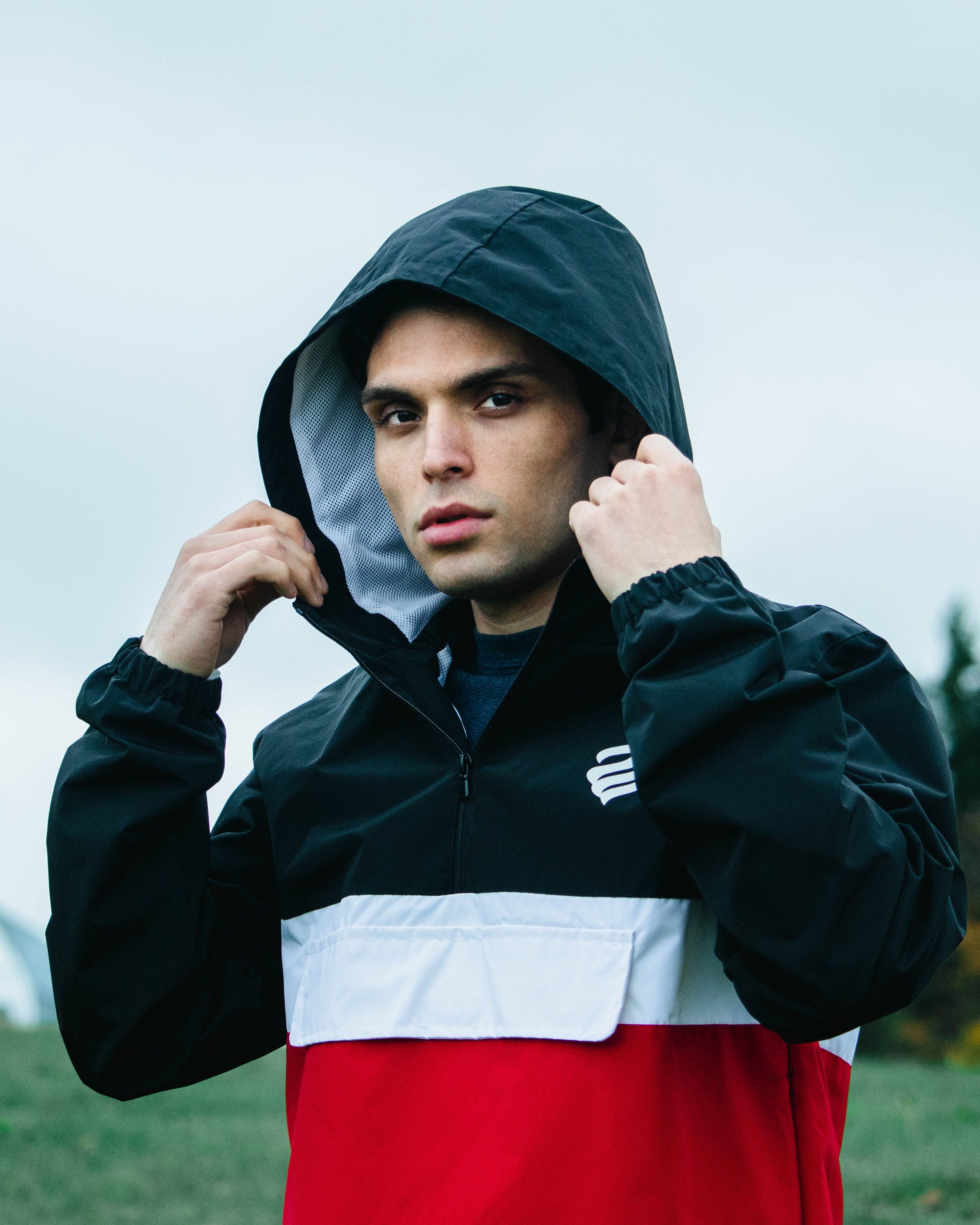 Man Posing in Jacket with Hood · Free Stock Photo