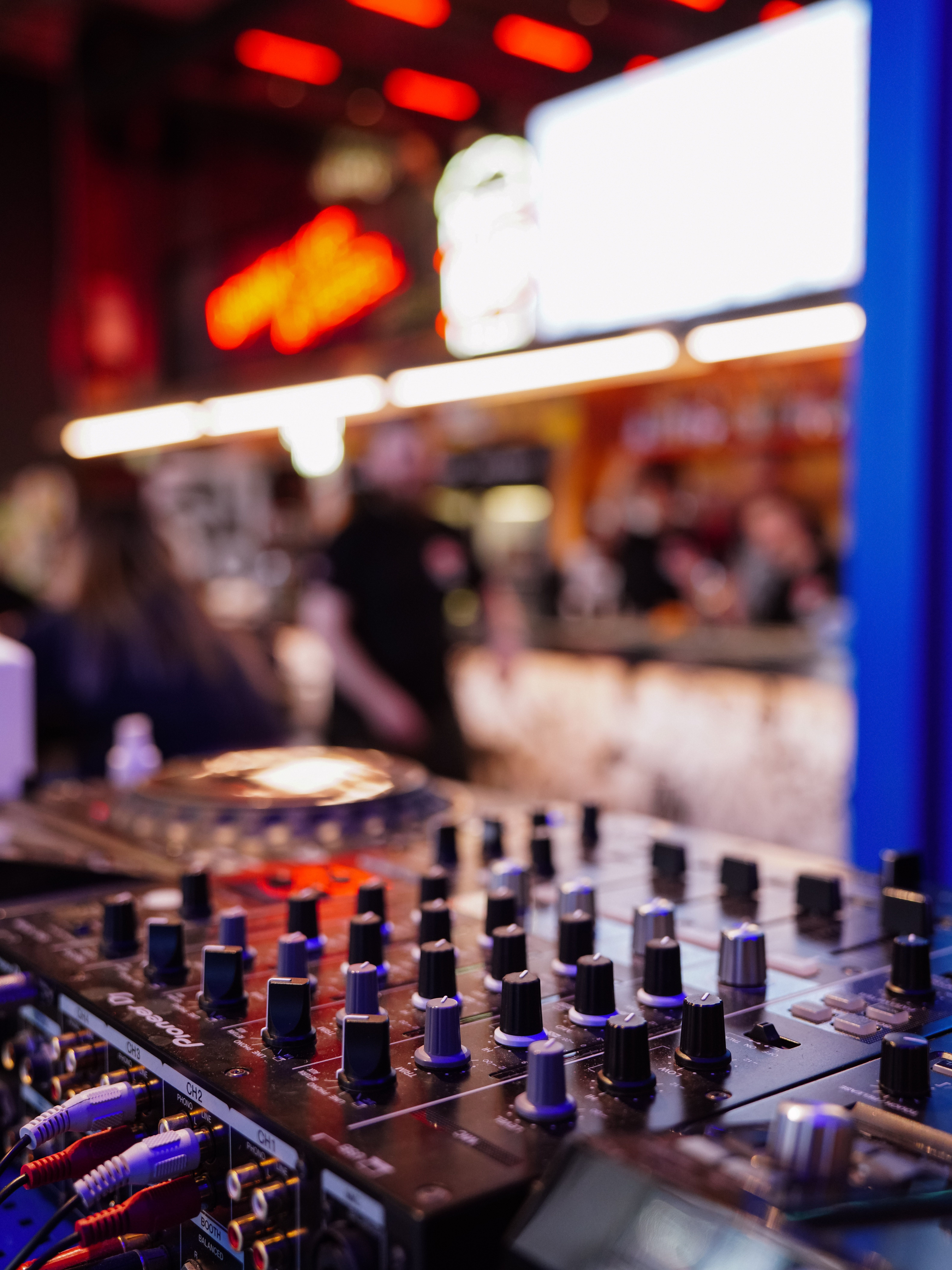 Close-up on DJs Mixing Console in Pub · Free Stock Photo