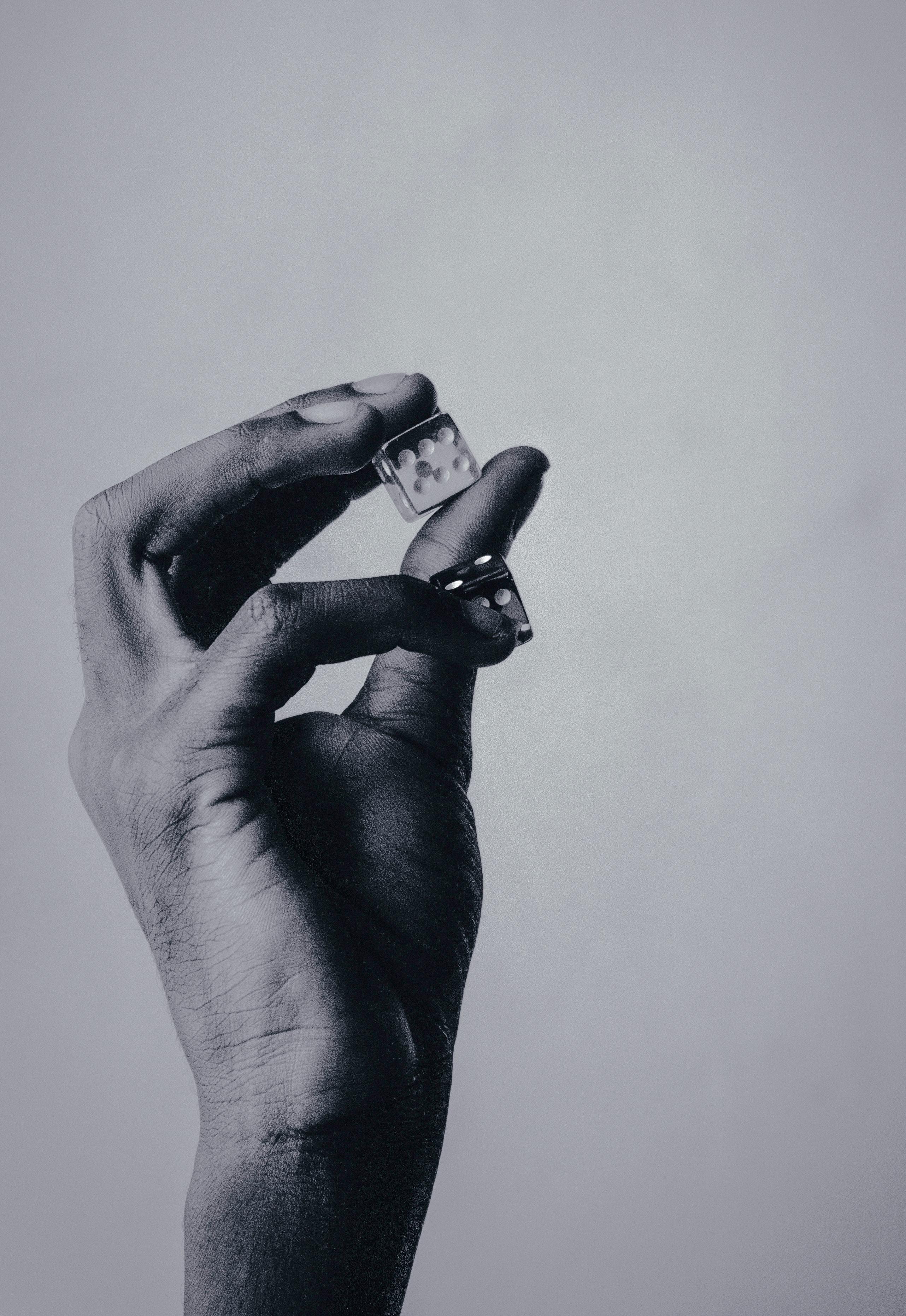 Hand Holding Two Dice · Free Stock Photo