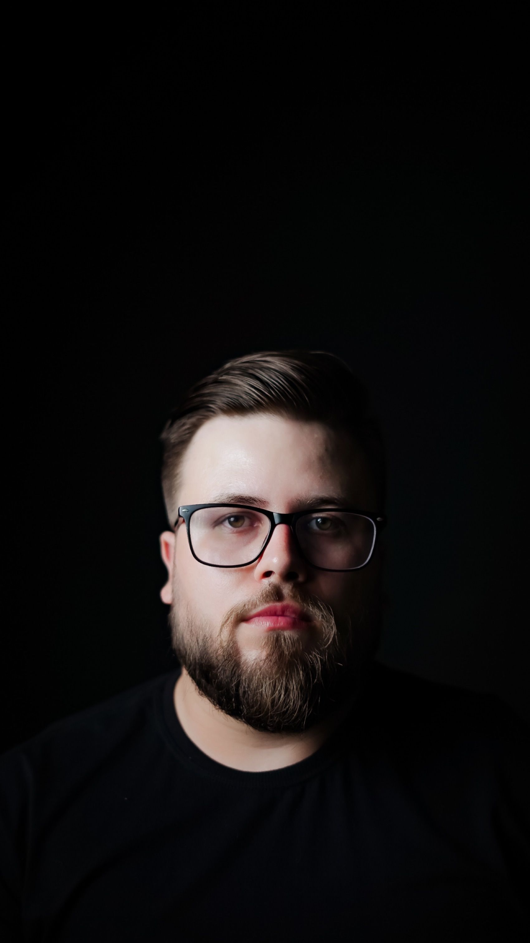 Portrait of a Bearded Man against Black Background · Free Stock Photo