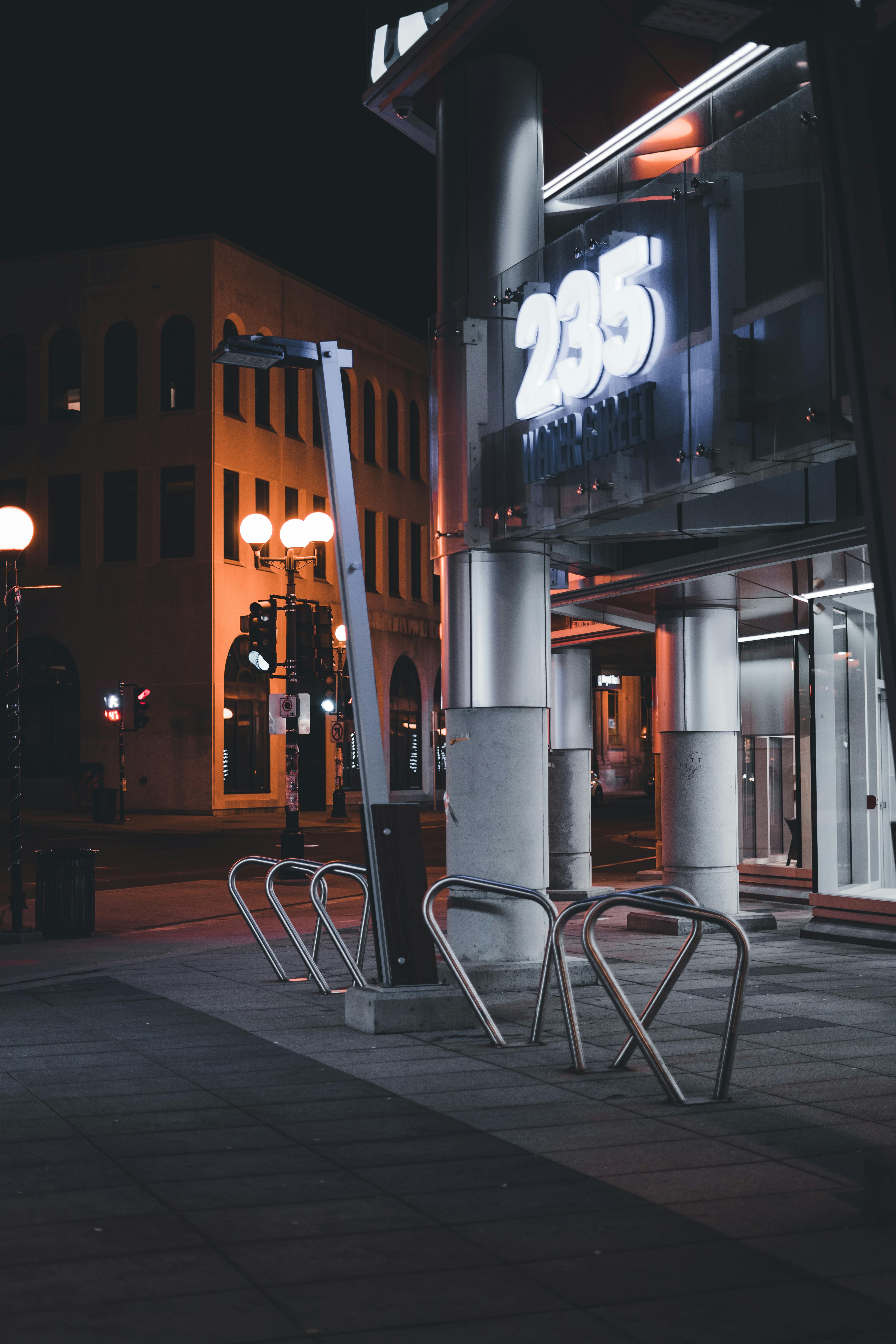 Silhouettes and Shadows of People Walking on the Sidewalk at Night ...