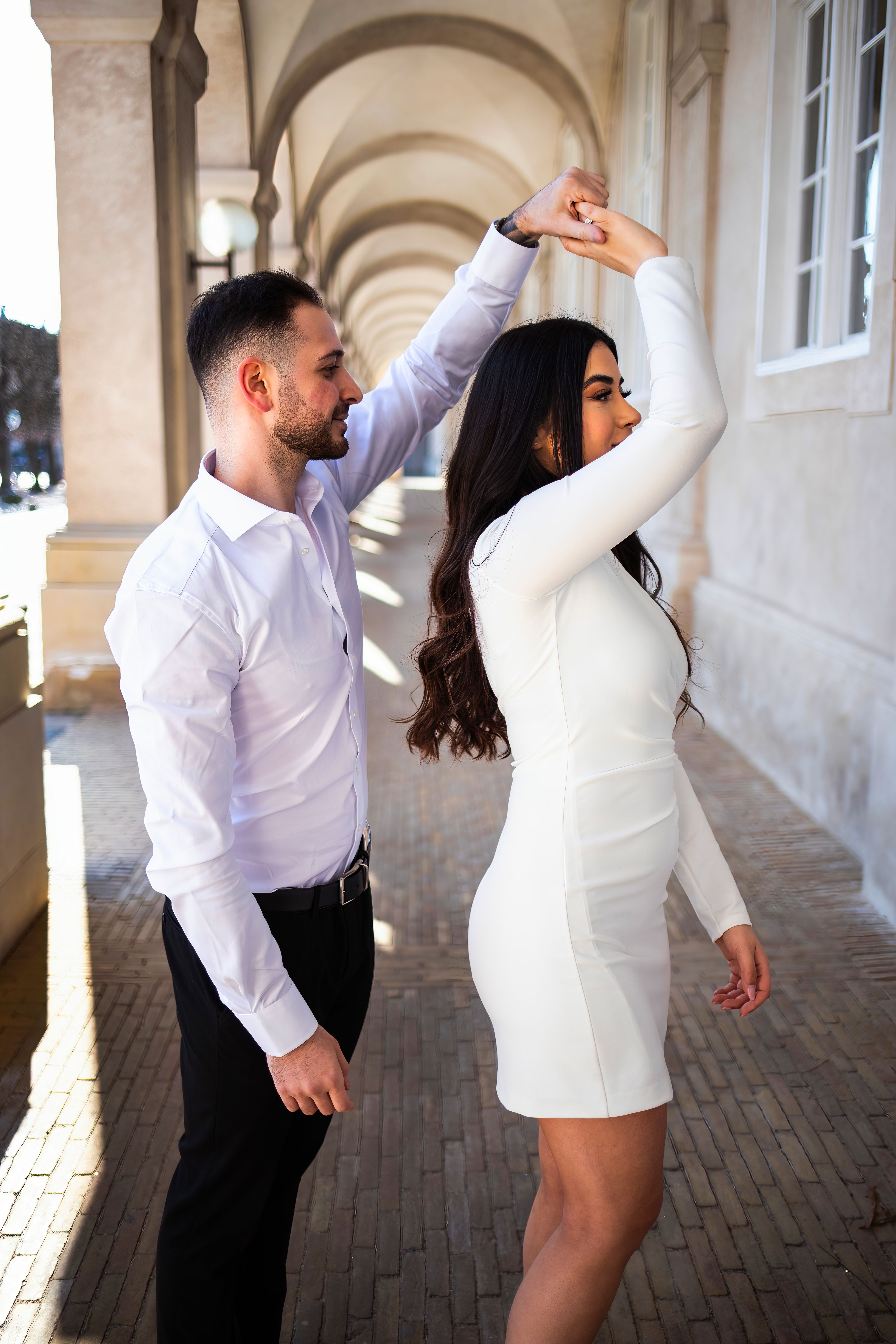 Man Holding Woman Hand over Head · Free Stock Photo