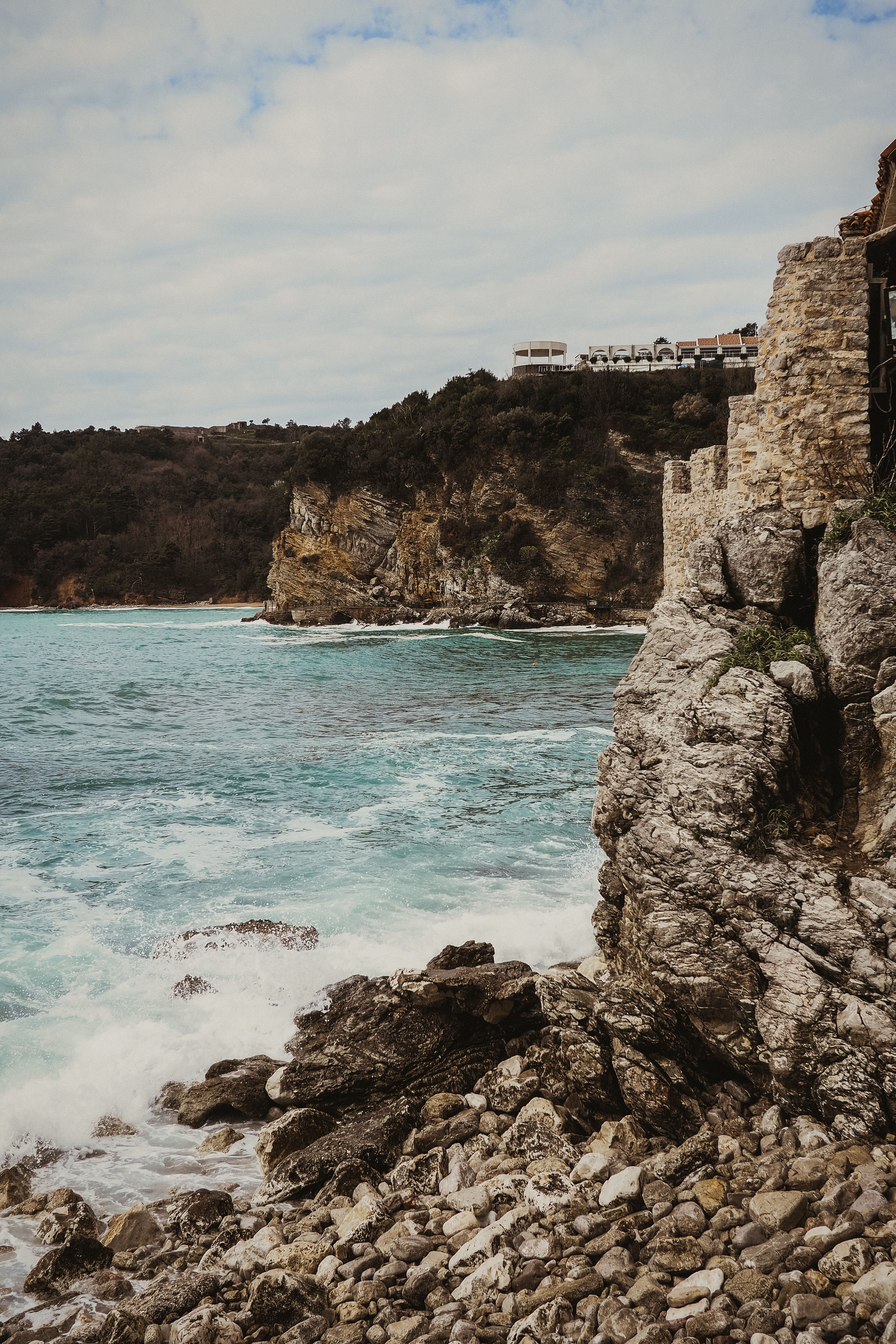 Cliff and Rocks on Sea Shore · Free Stock Photo