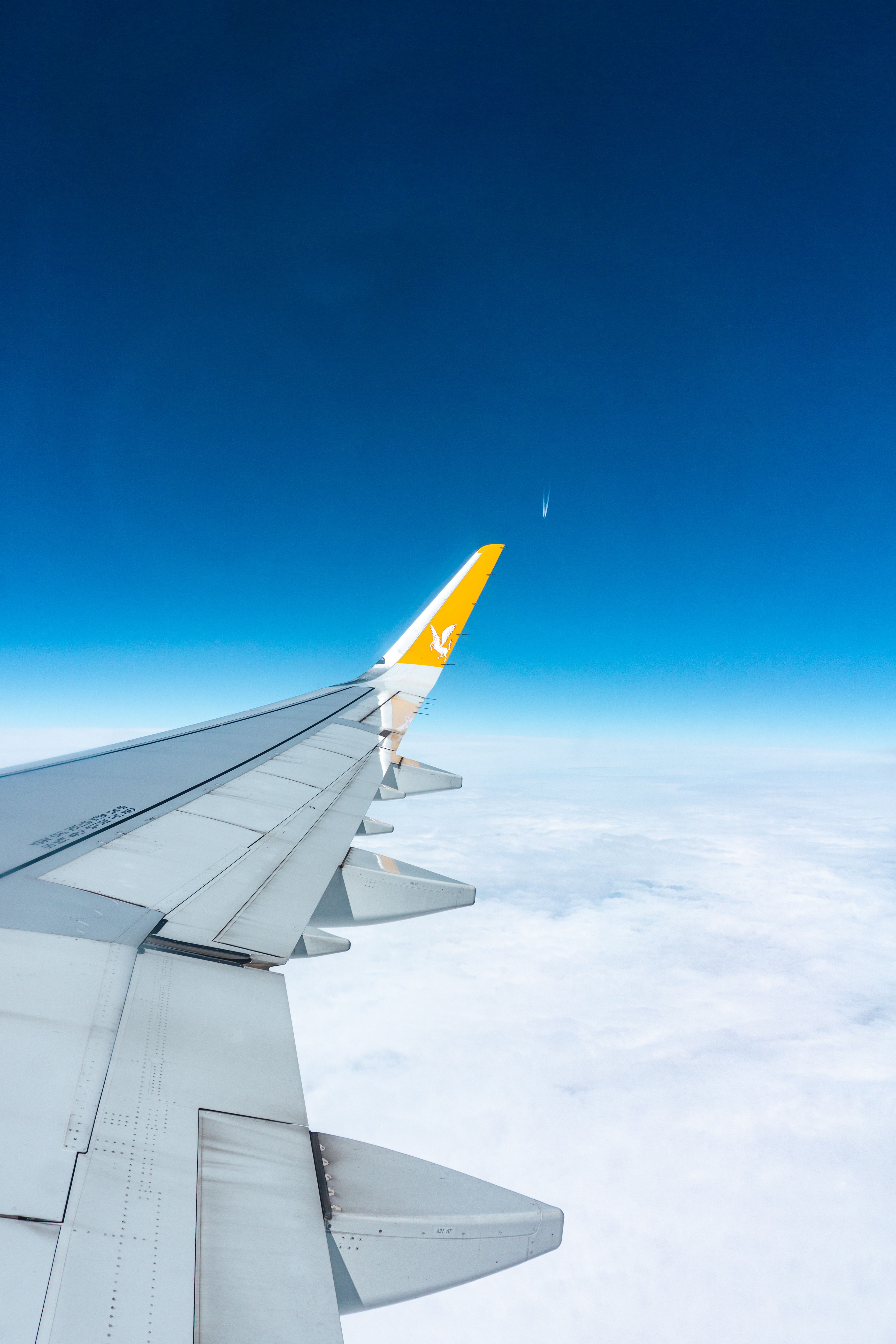 Wing of Flying Airplane · Free Stock Photo