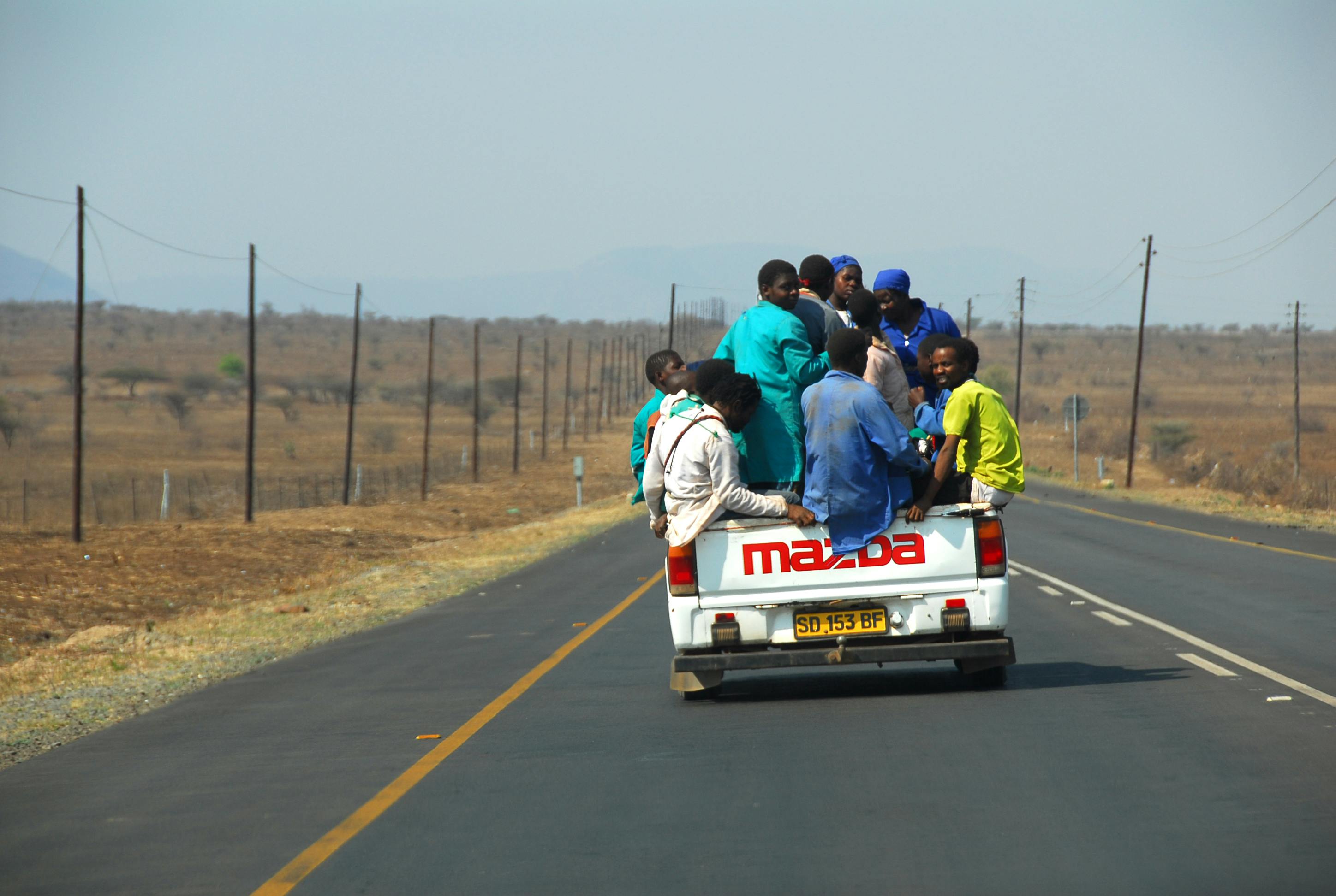 People and Children on Mazda Truck · Free Stock Photo