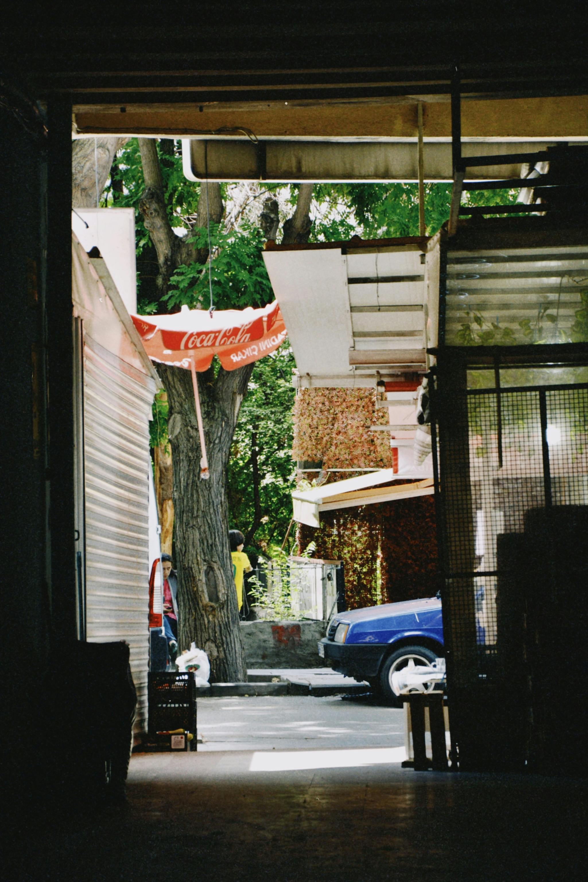 Car on Street behind Alley in Town · Free Stock Photo