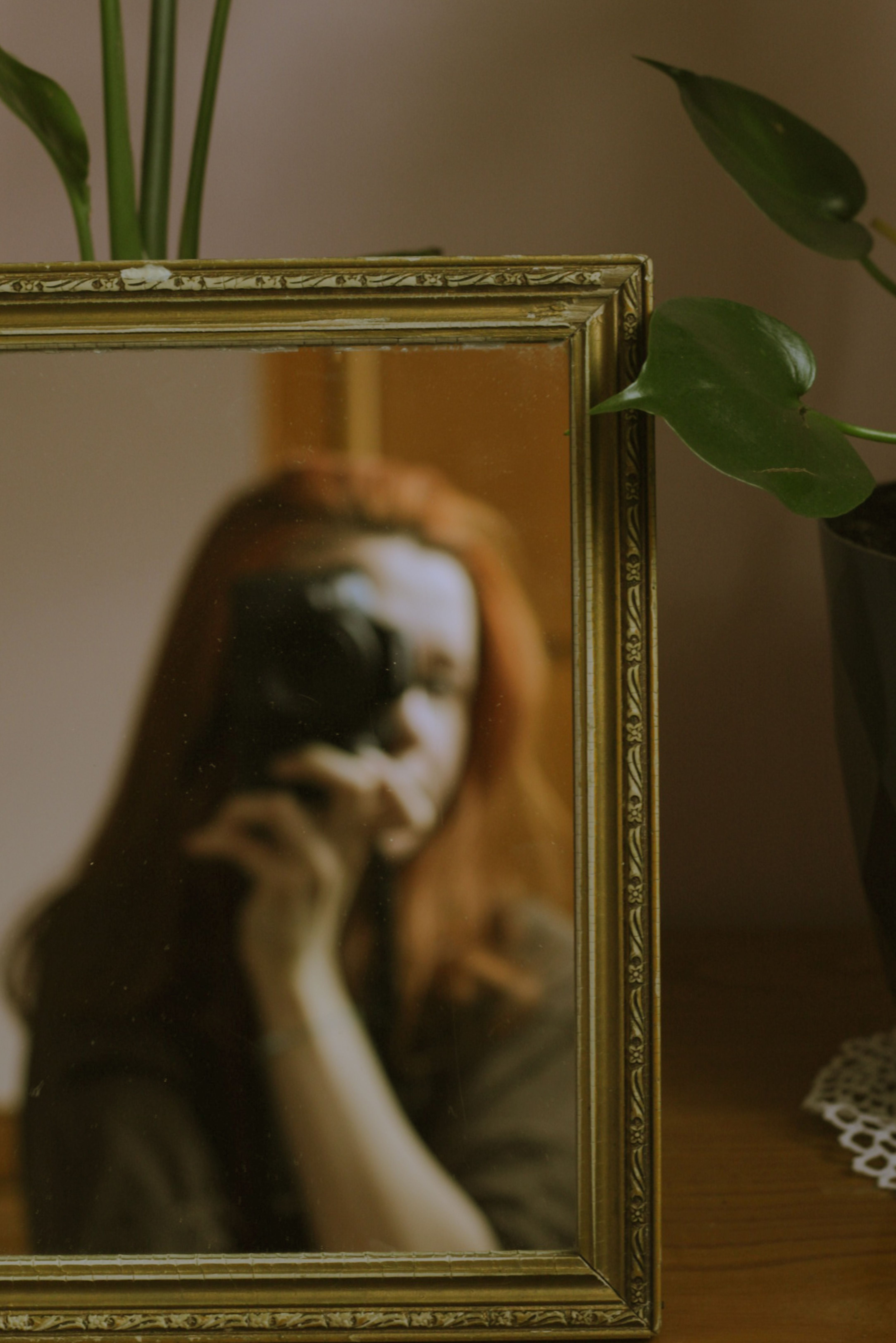 Photo of a Redhead Woman Reflecting in the Mirror · Free Stock Photo