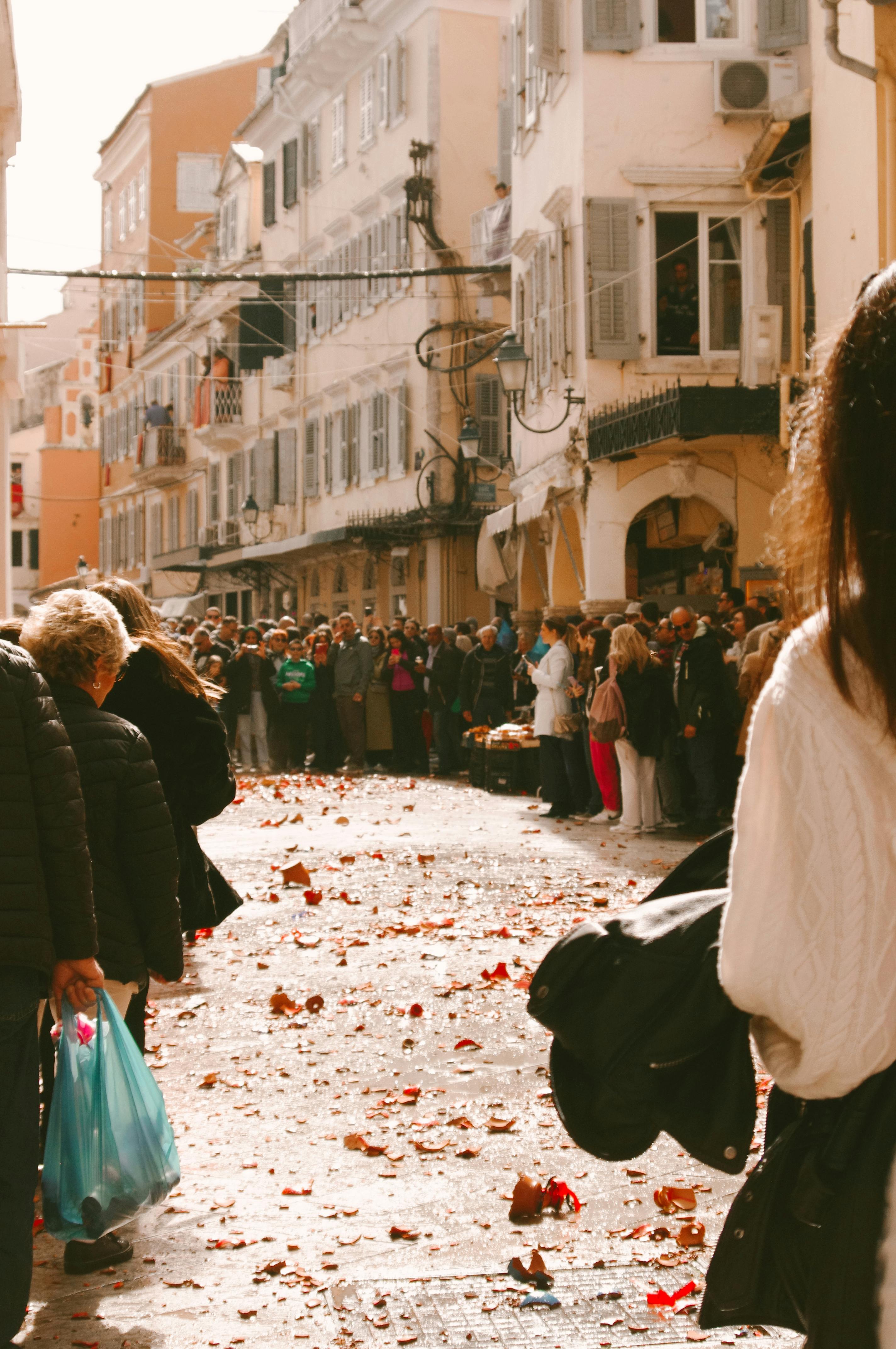 Woman Holding Balloons Surrounded by People at the Road · Free Stock Photo