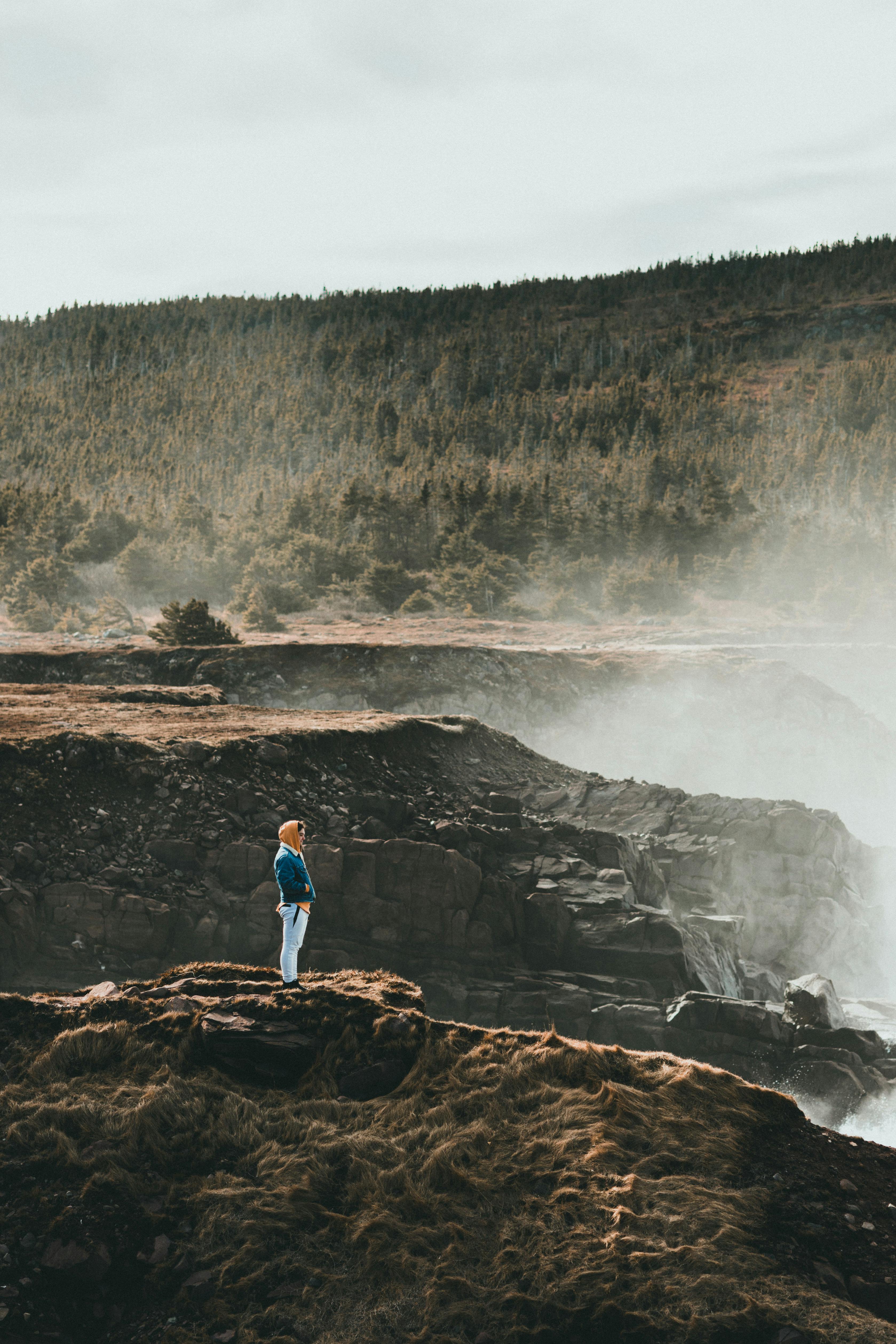 A Couple Standing At The Edge Of A Breathtaking, Secluded Landscape ...