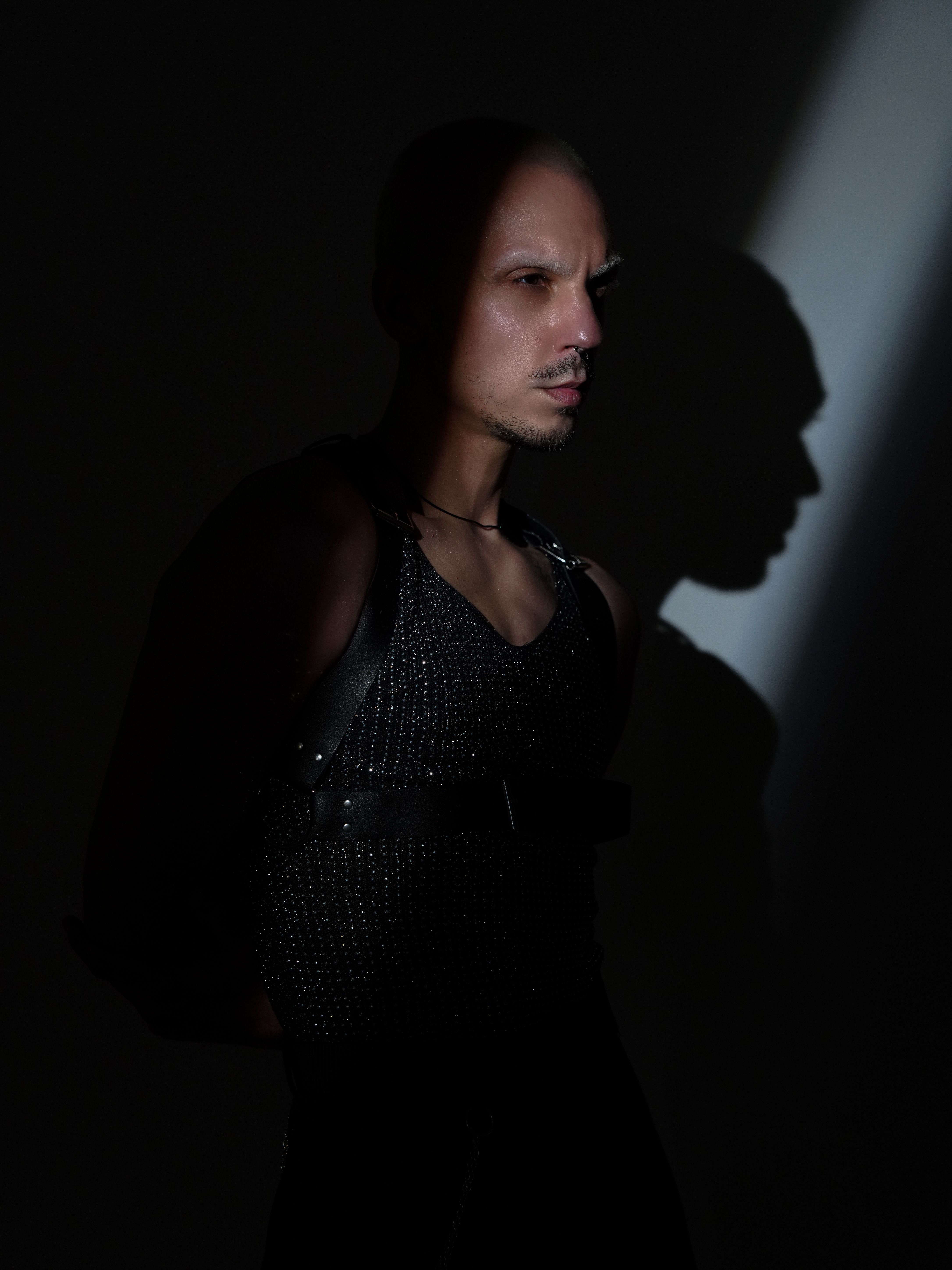Man Posing in Studio in a Shadow · Free Stock Photo
