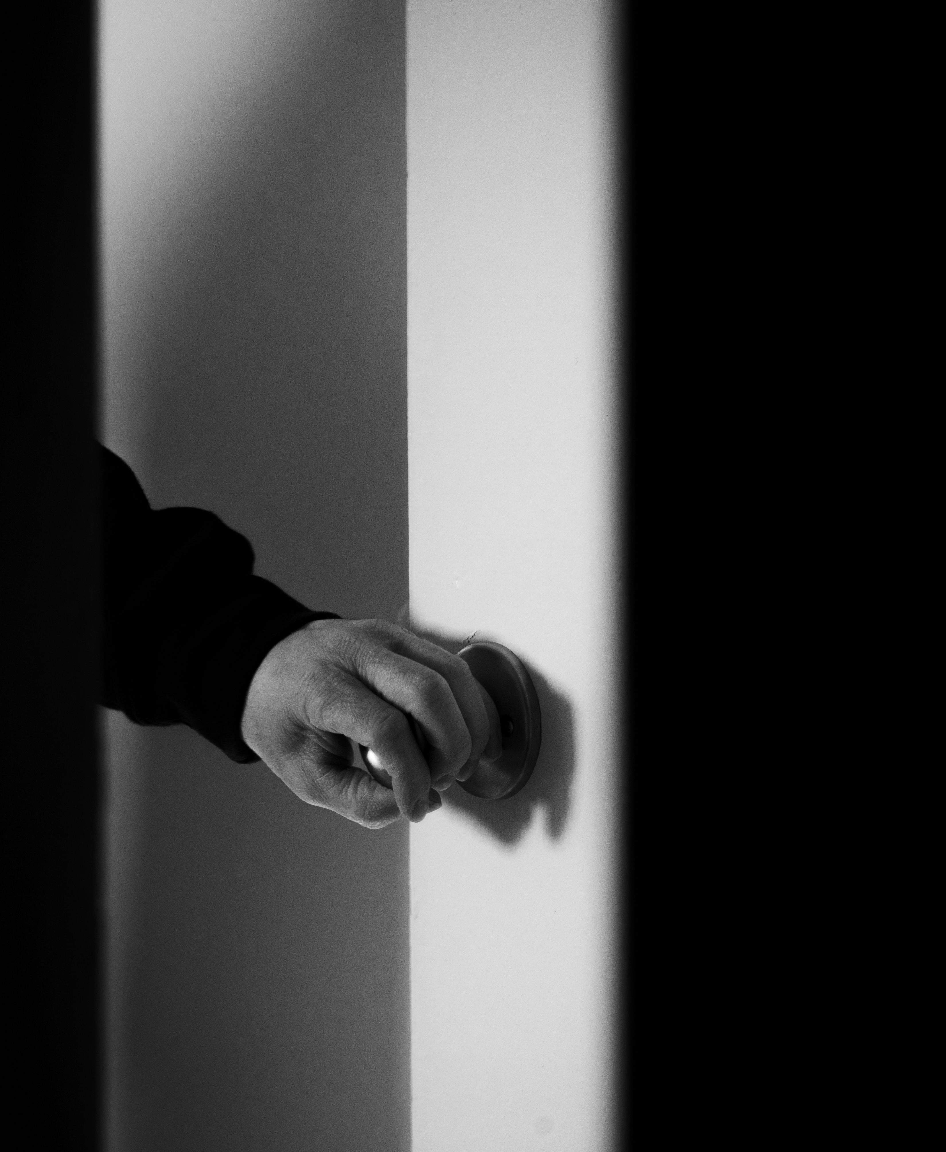 Close-Up Shot of a Person Opening a Door · Free Stock Photo