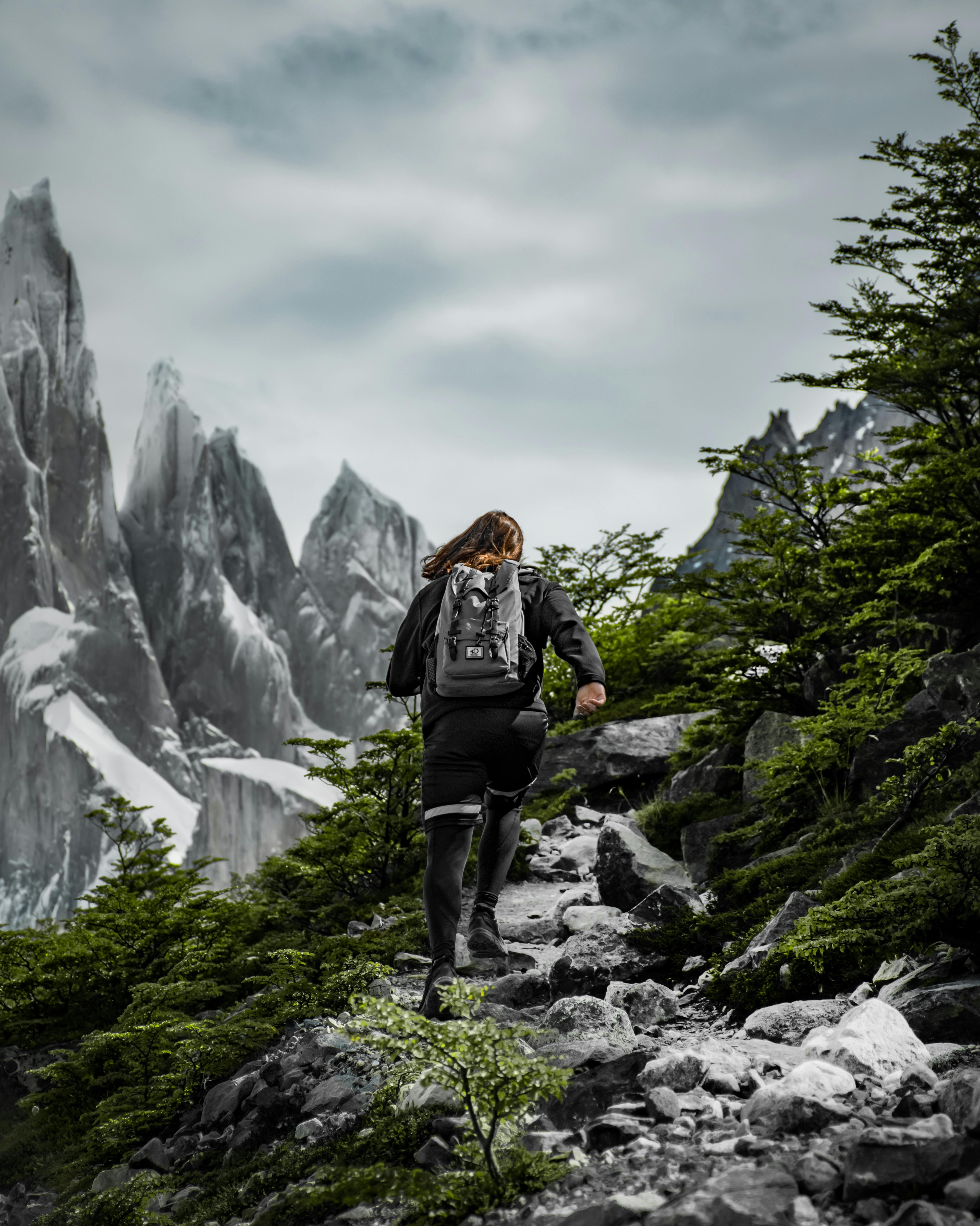 Back View of Person Hiking in Rocky Mountains · Free Stock Photo