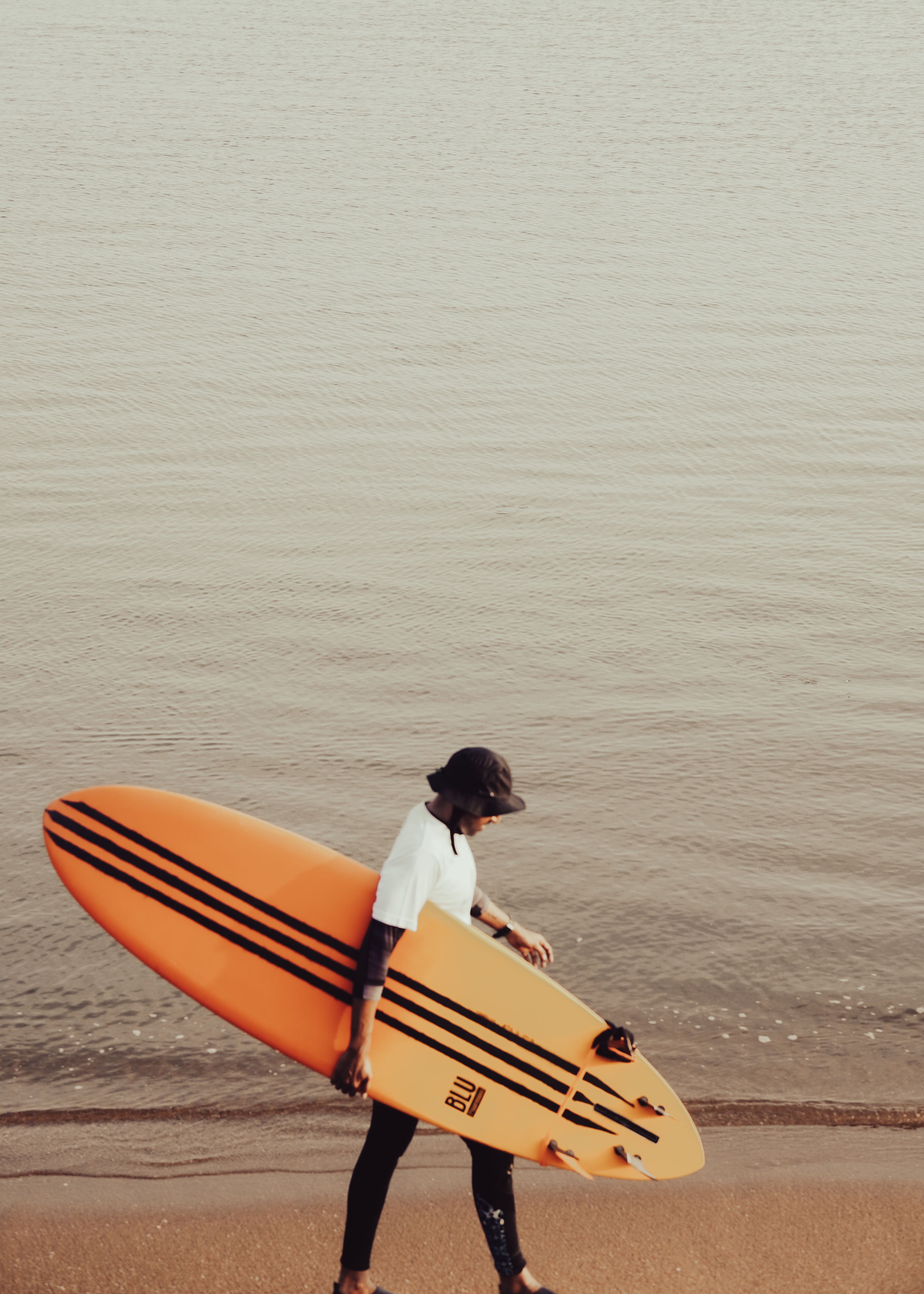 Surfer Carrying Surfboard · Free Stock Photo