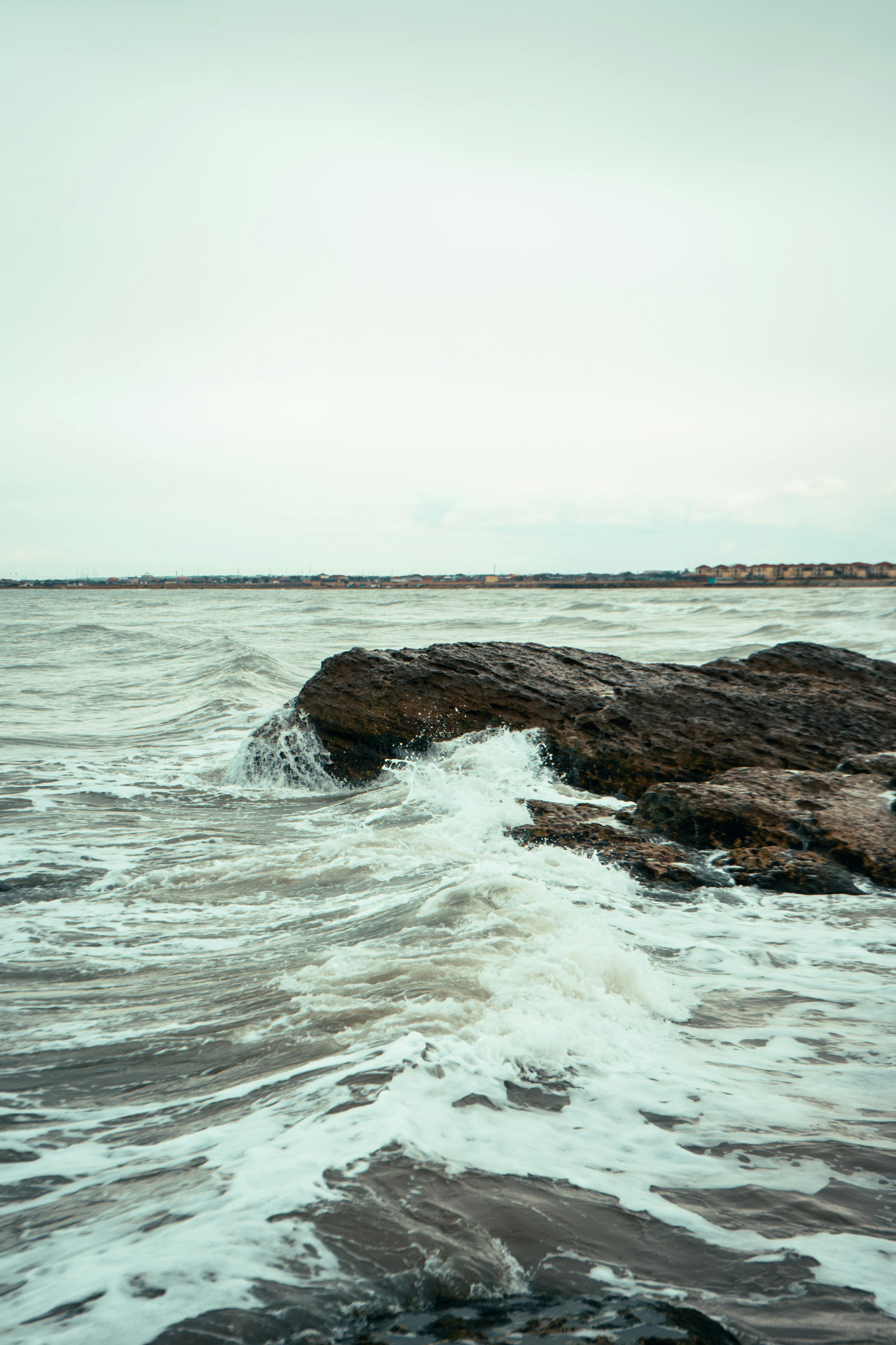 Brown Rock Island on Sea Water Under Blue Sky during Daytime · Free ...