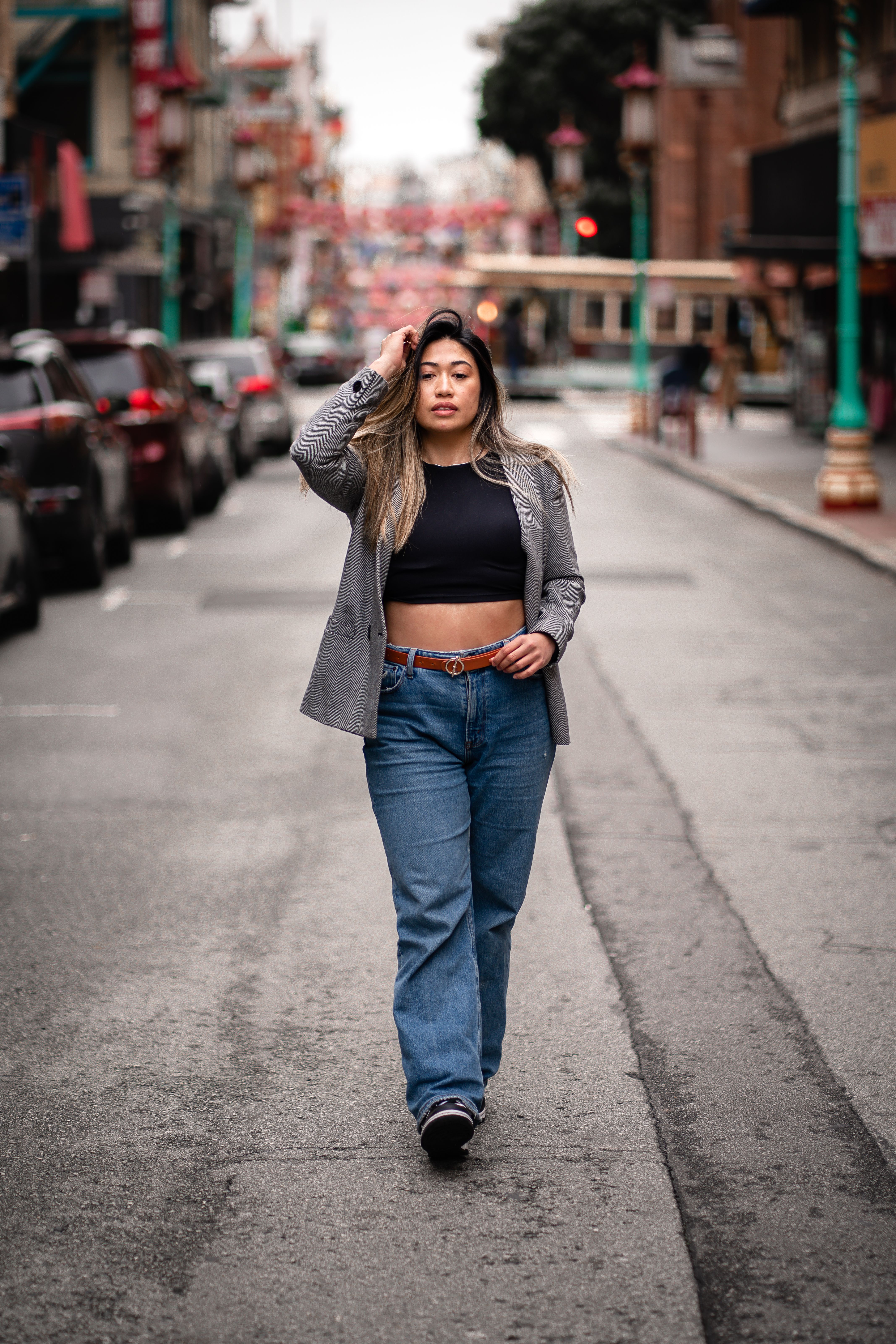 Young Woman Wearing Ripped Jeans Standing in the Middle of the Road ...