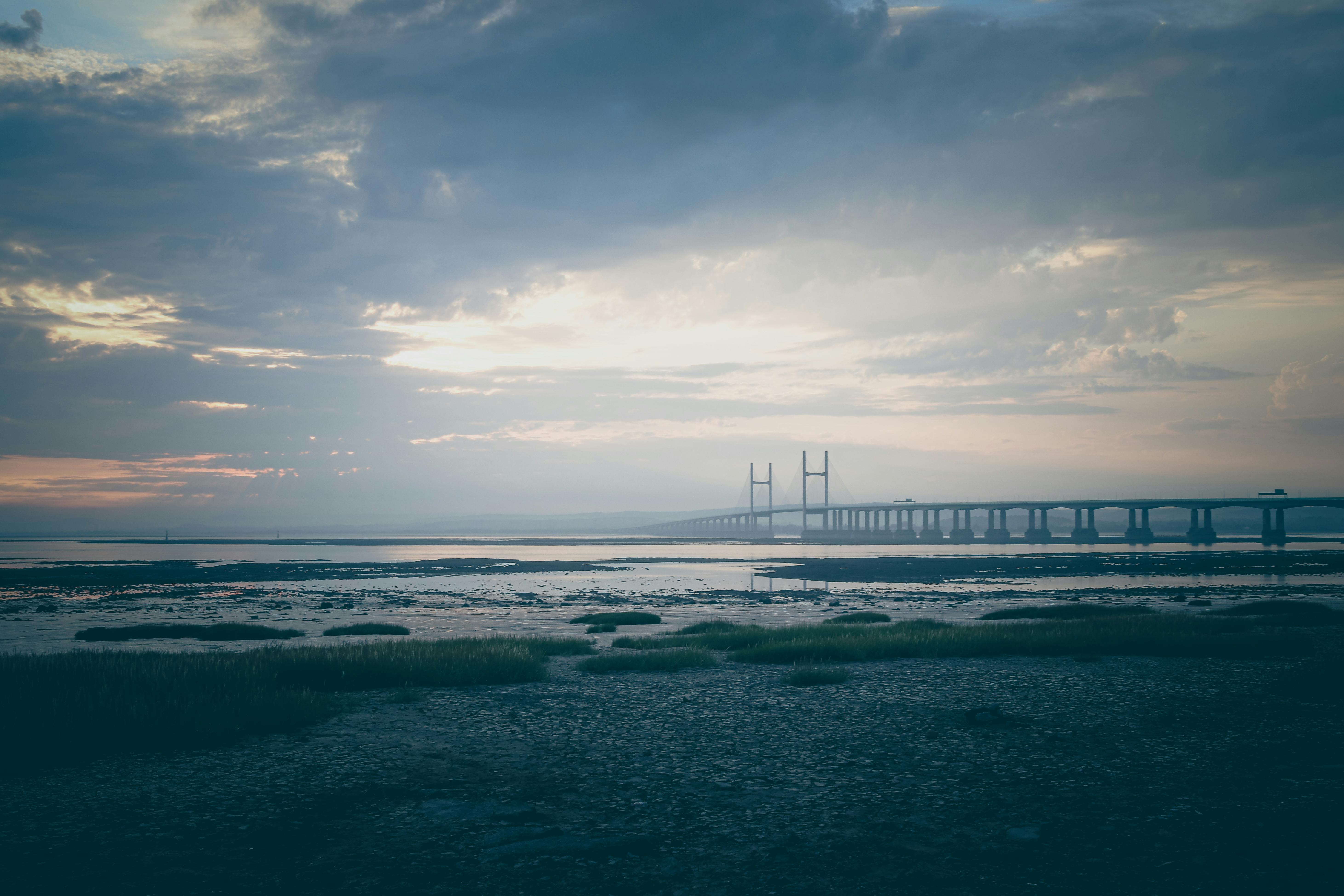 Clouds over Bridge on Sea Coast · Free Stock Photo