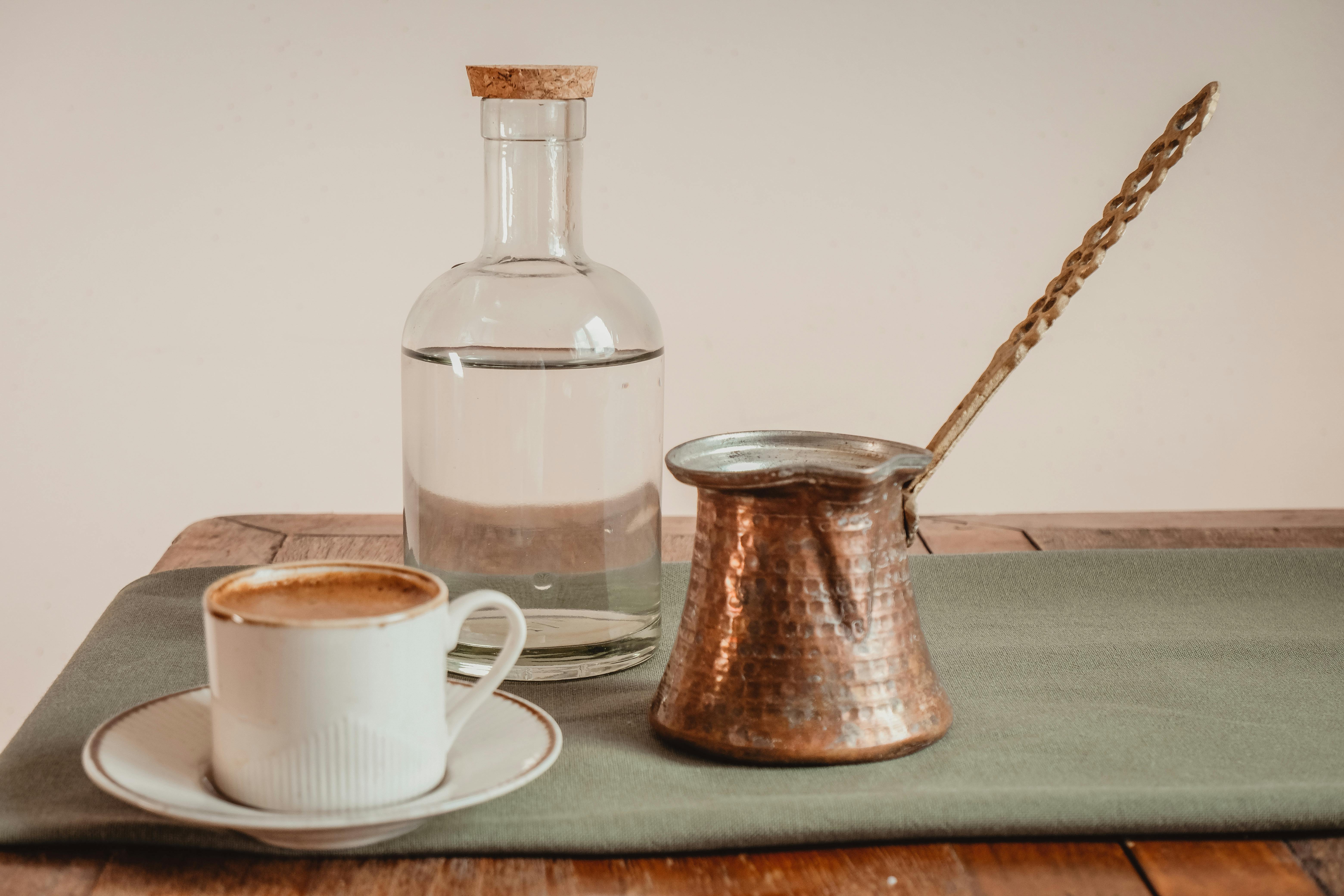 Turkish Kettle, Bottle of Water and Coffee Cup · Free Stock Photo