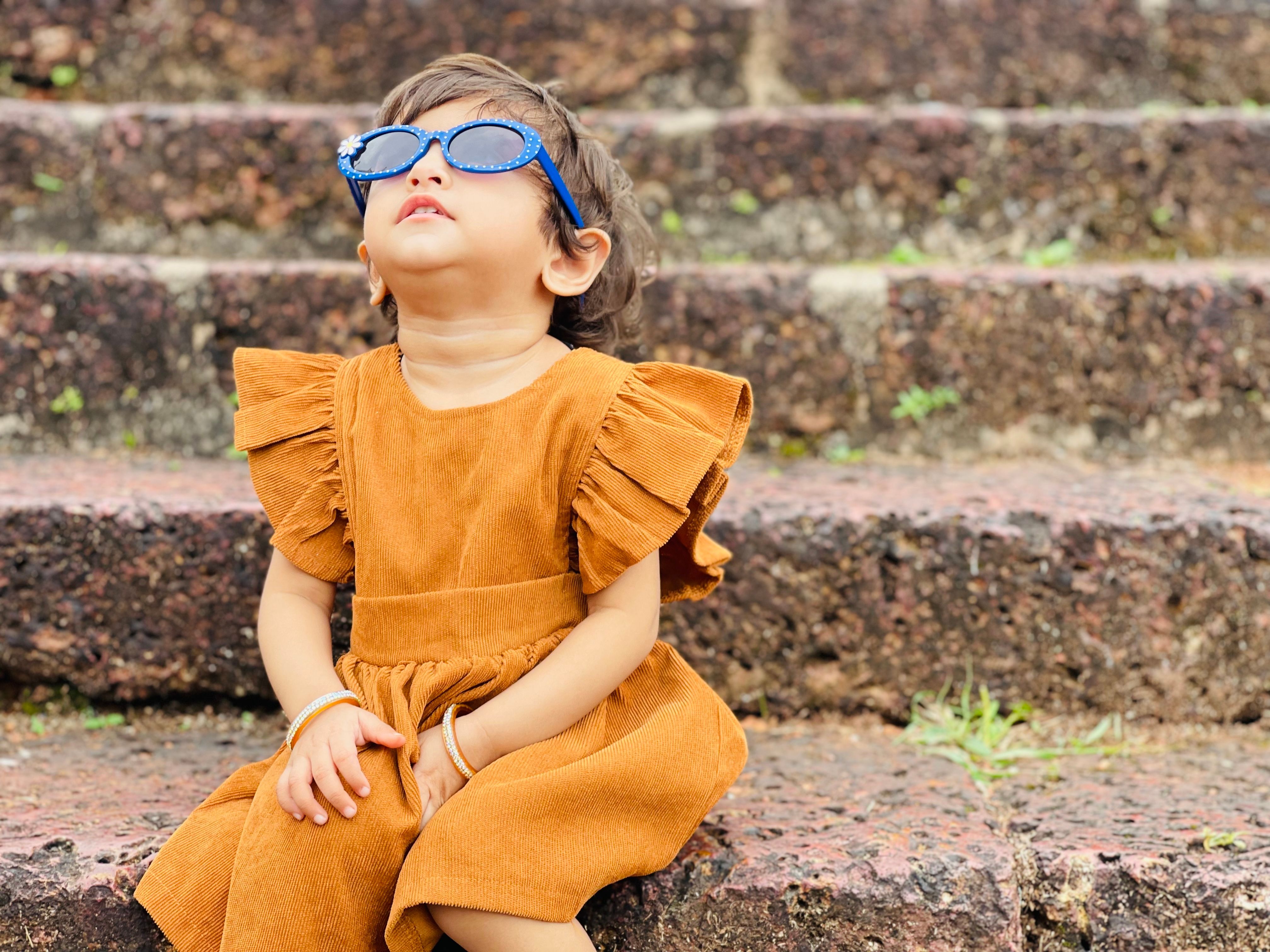Girl in Cord Dress · Free Stock Photo